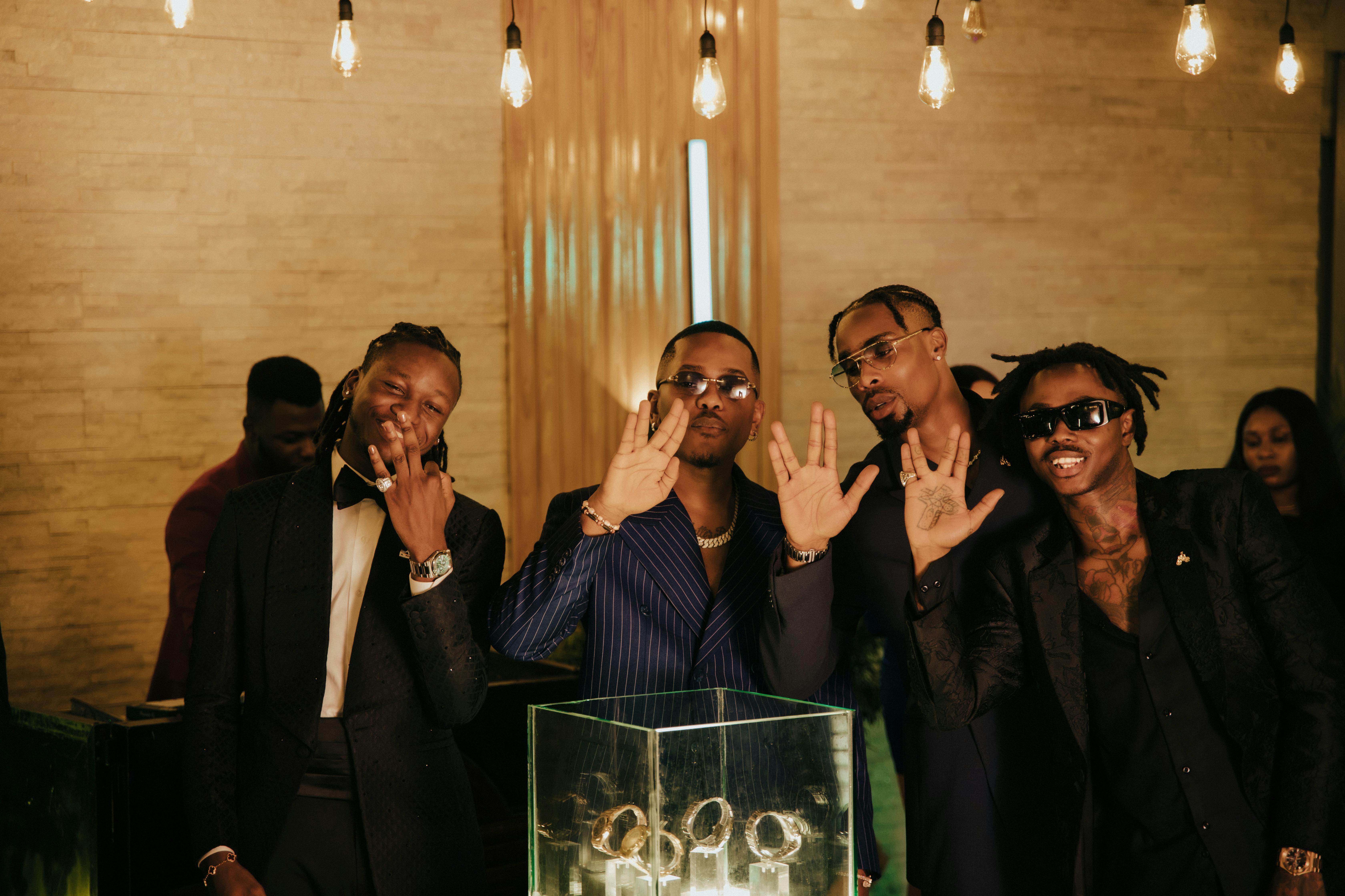 Men in Suits Saluting at Party · Free Stock Photo