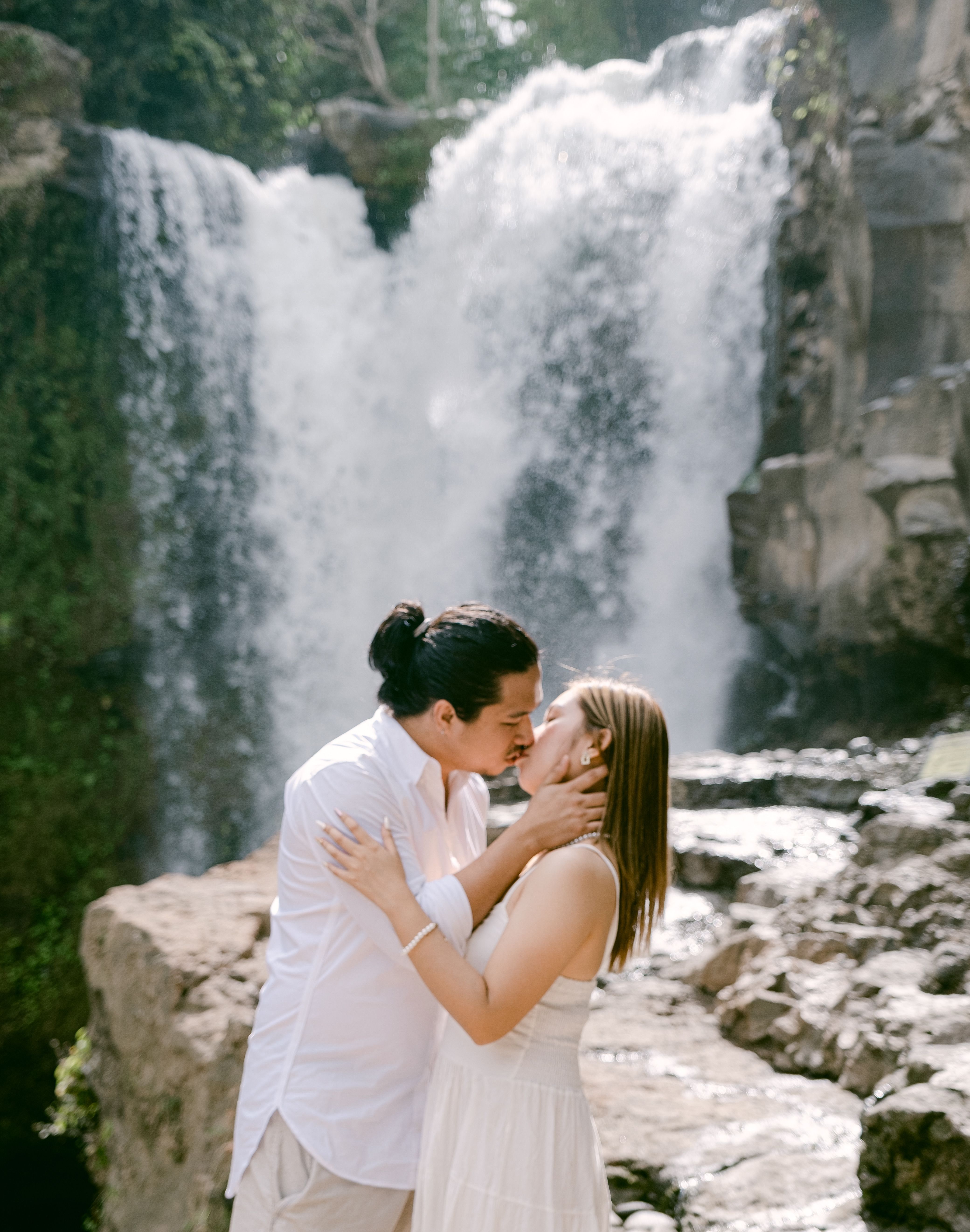Portrait of Couple Kissing by Waterfall · Free Stock Photo
