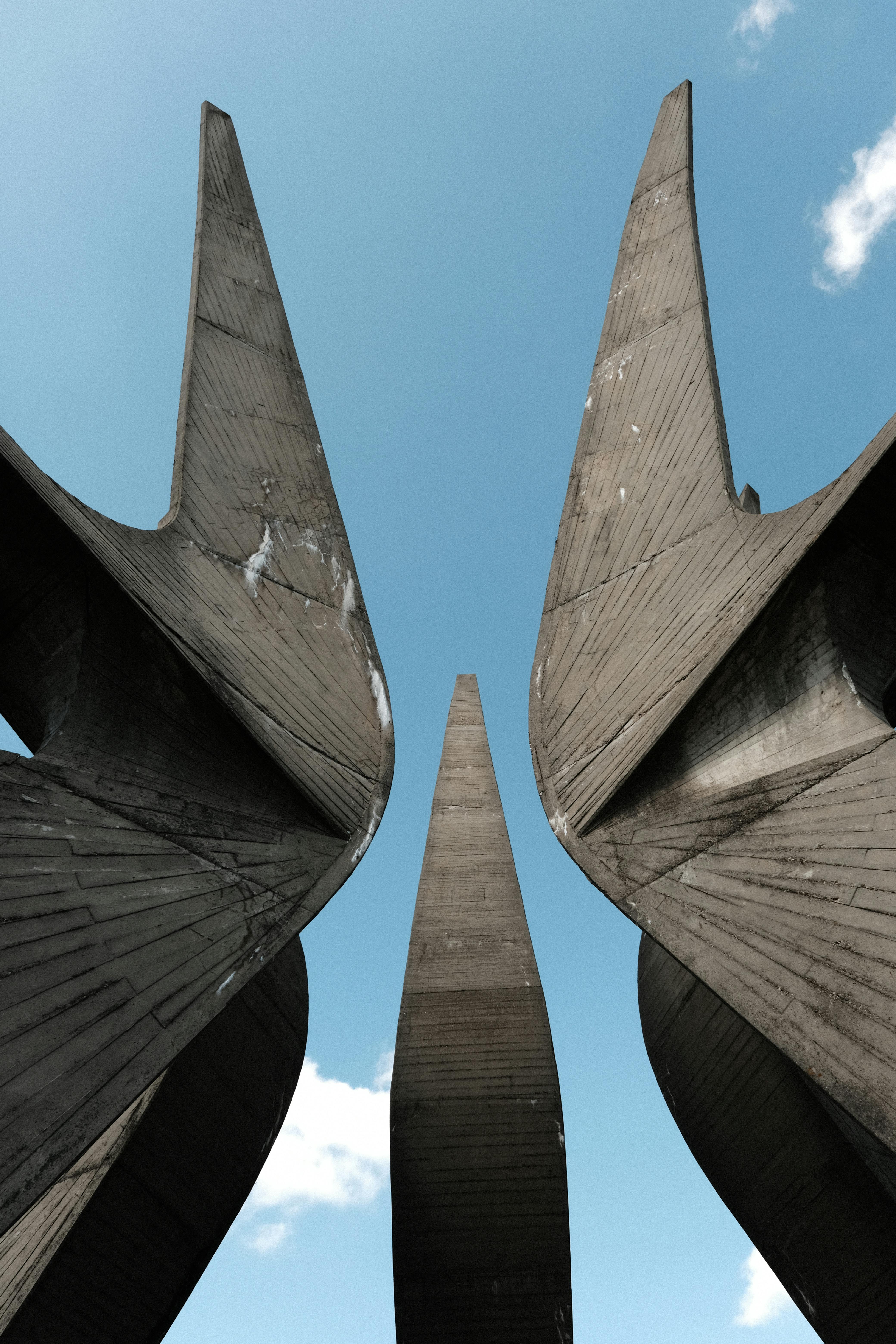 Two large metal sculptures with two large wings · Free Stock Photo