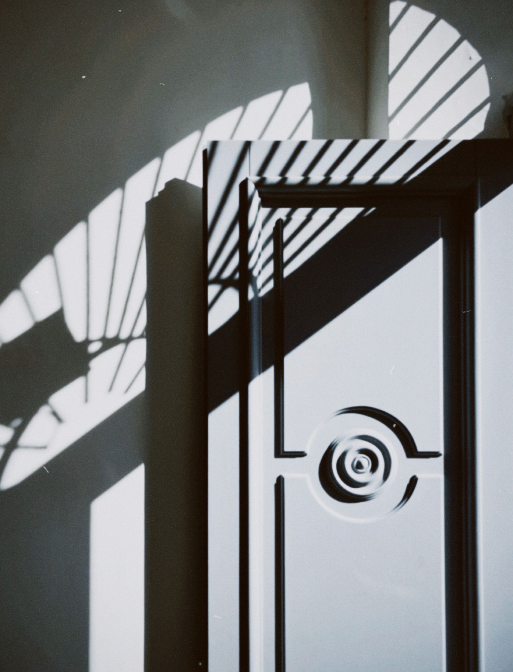 Shadow Cast on the Door and Wall of Building Interior · Free Stock Photo