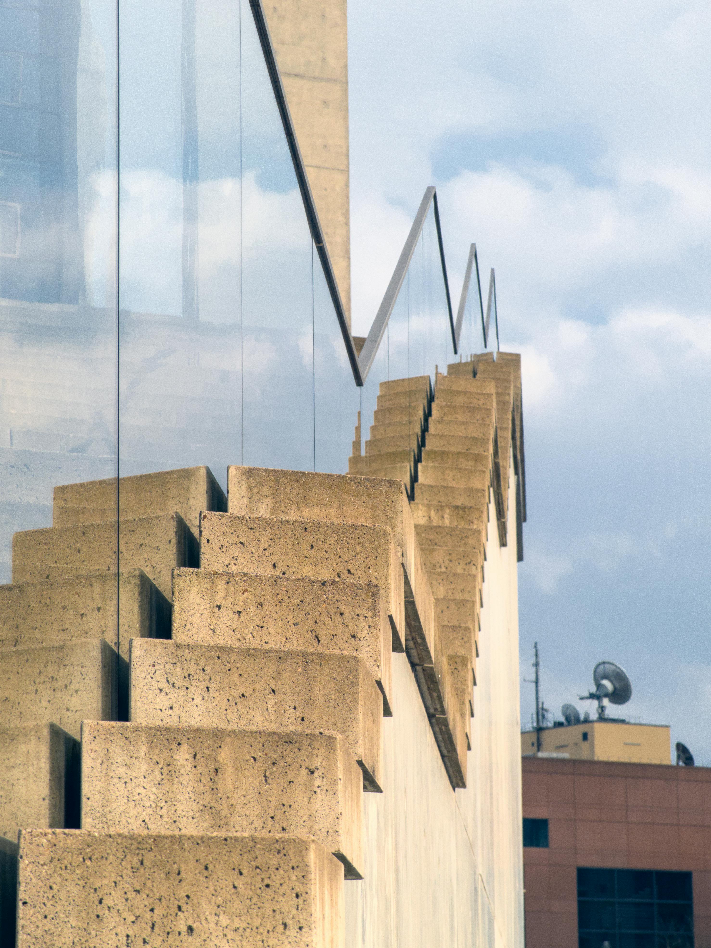 Glass Facade and Concrete Steps of a Modern Building · Free Stock Photo