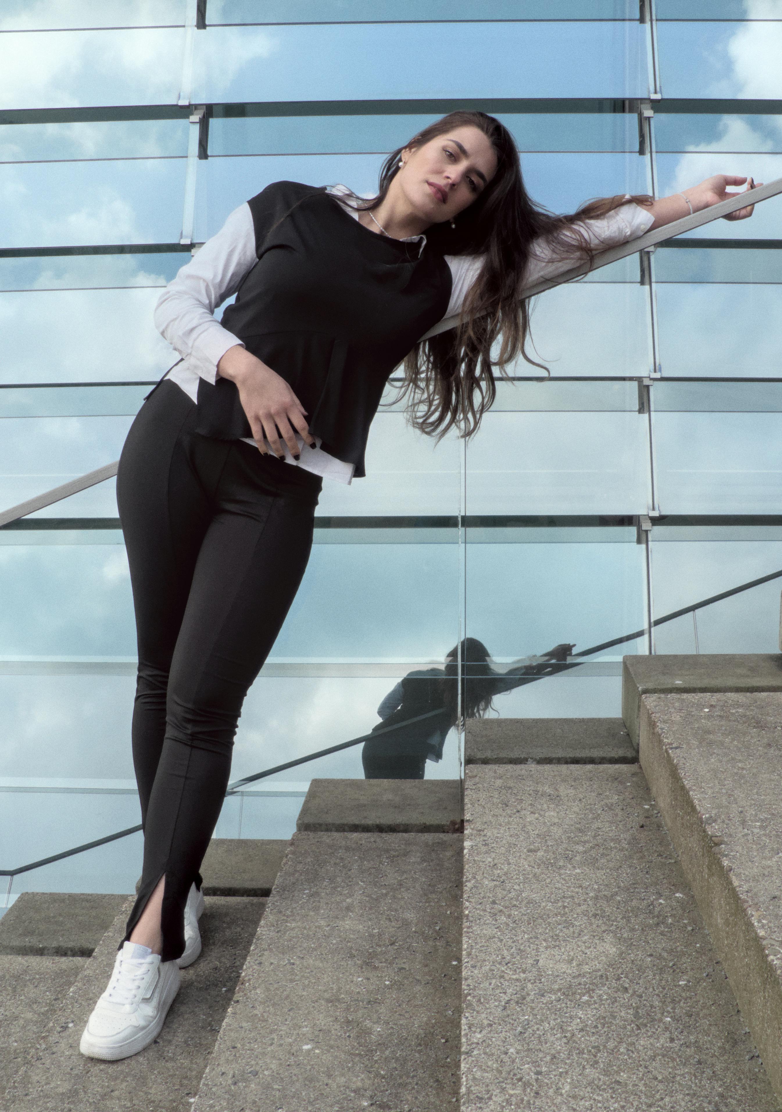 Woman Leaning Against a Rail · Free Stock Photo