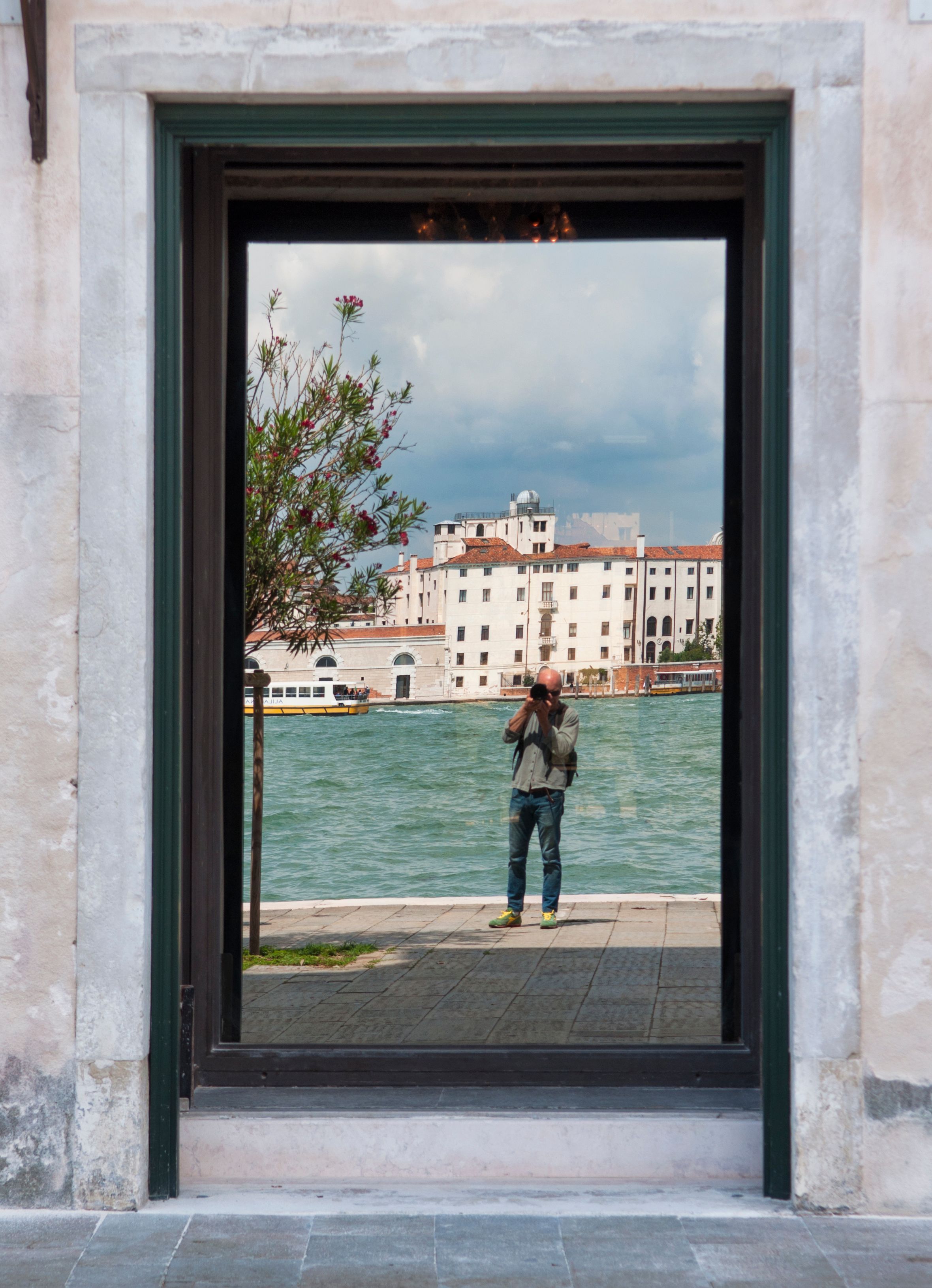 Reflection of a Photographer in a Window · Free Stock Photo