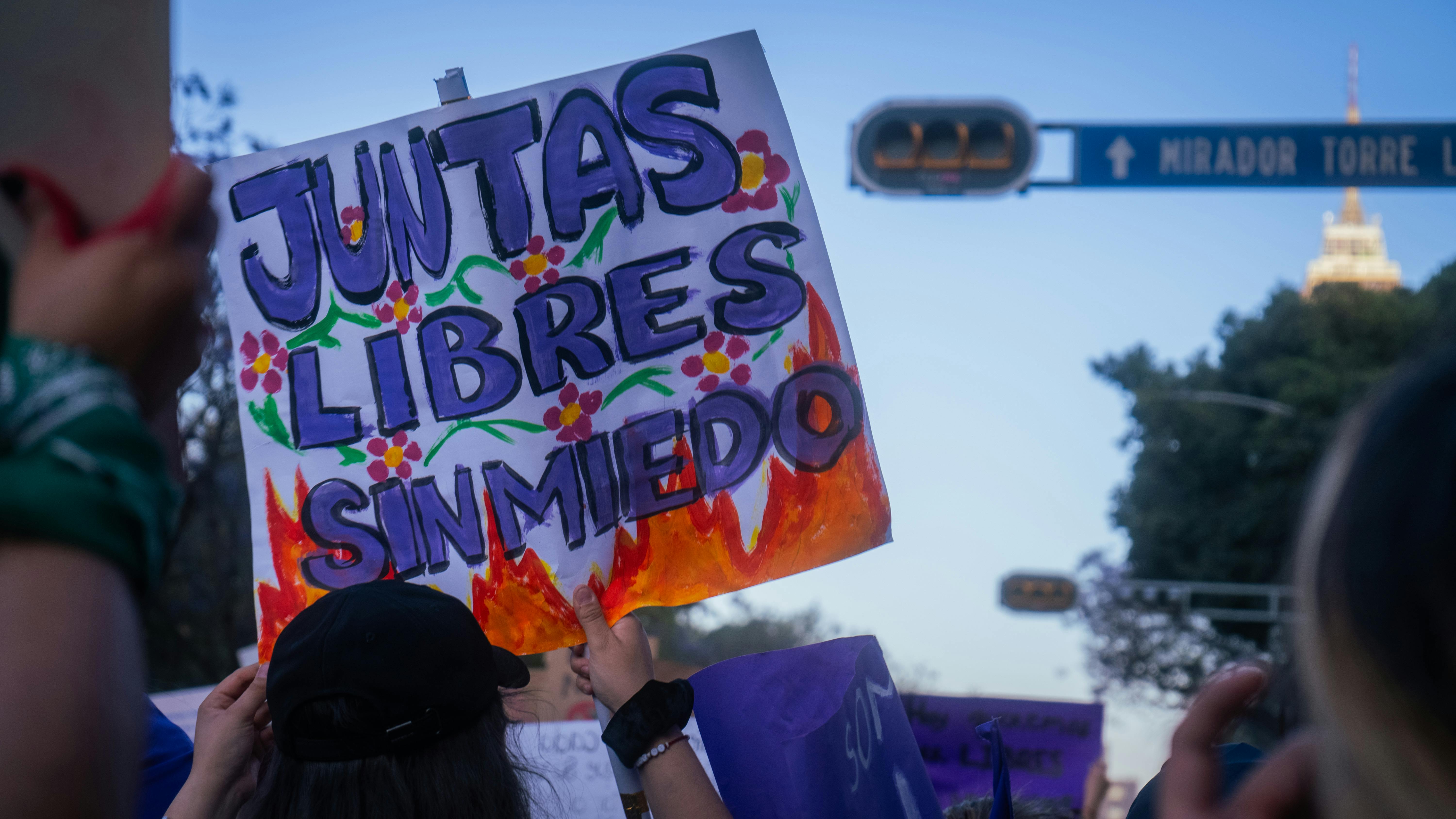 People Protesting on a Street with a Hand Written Banner · Free Stock Photo