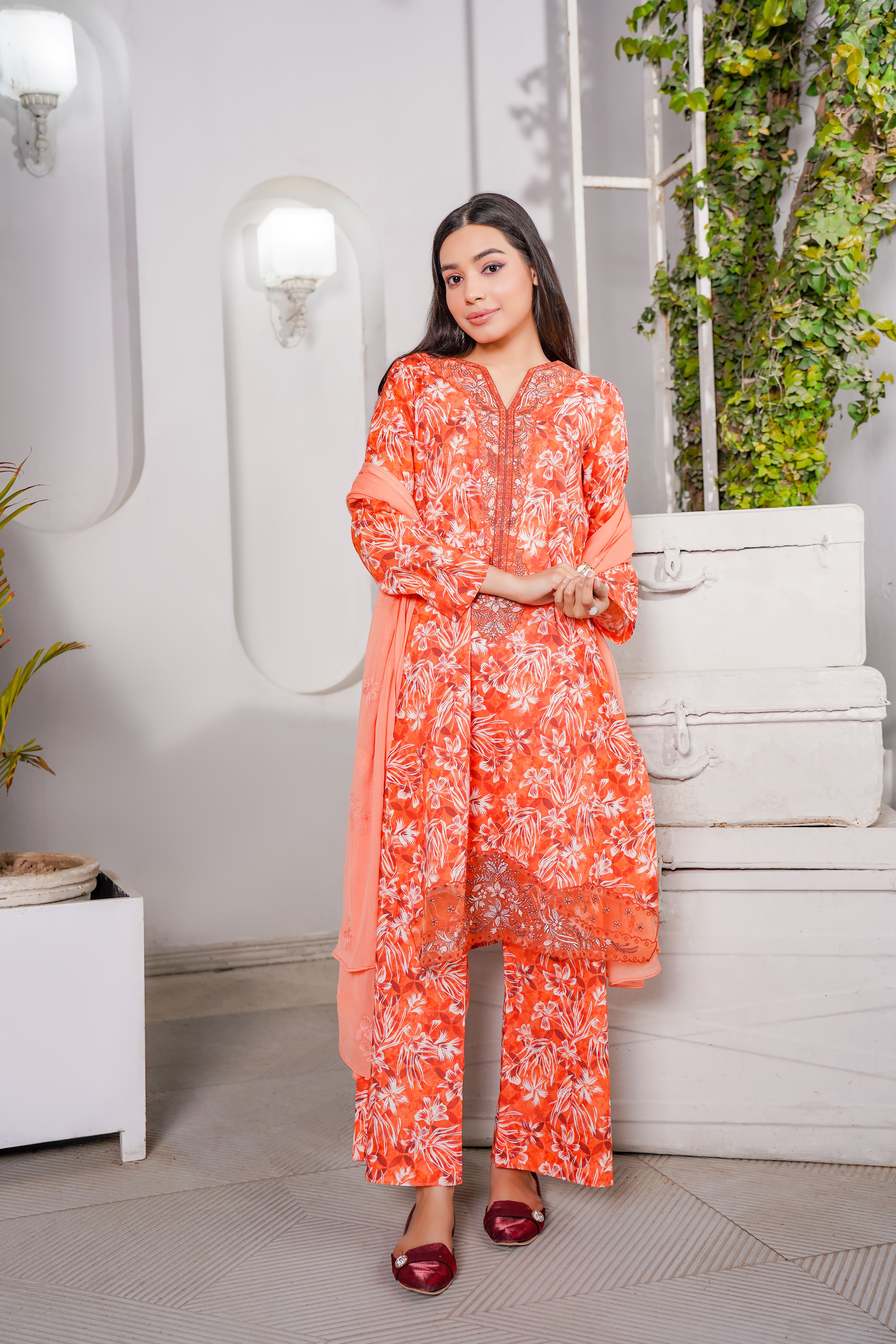 Brunette Woman in Oriental Dress Posing by White Boxes · Free Stock Photo