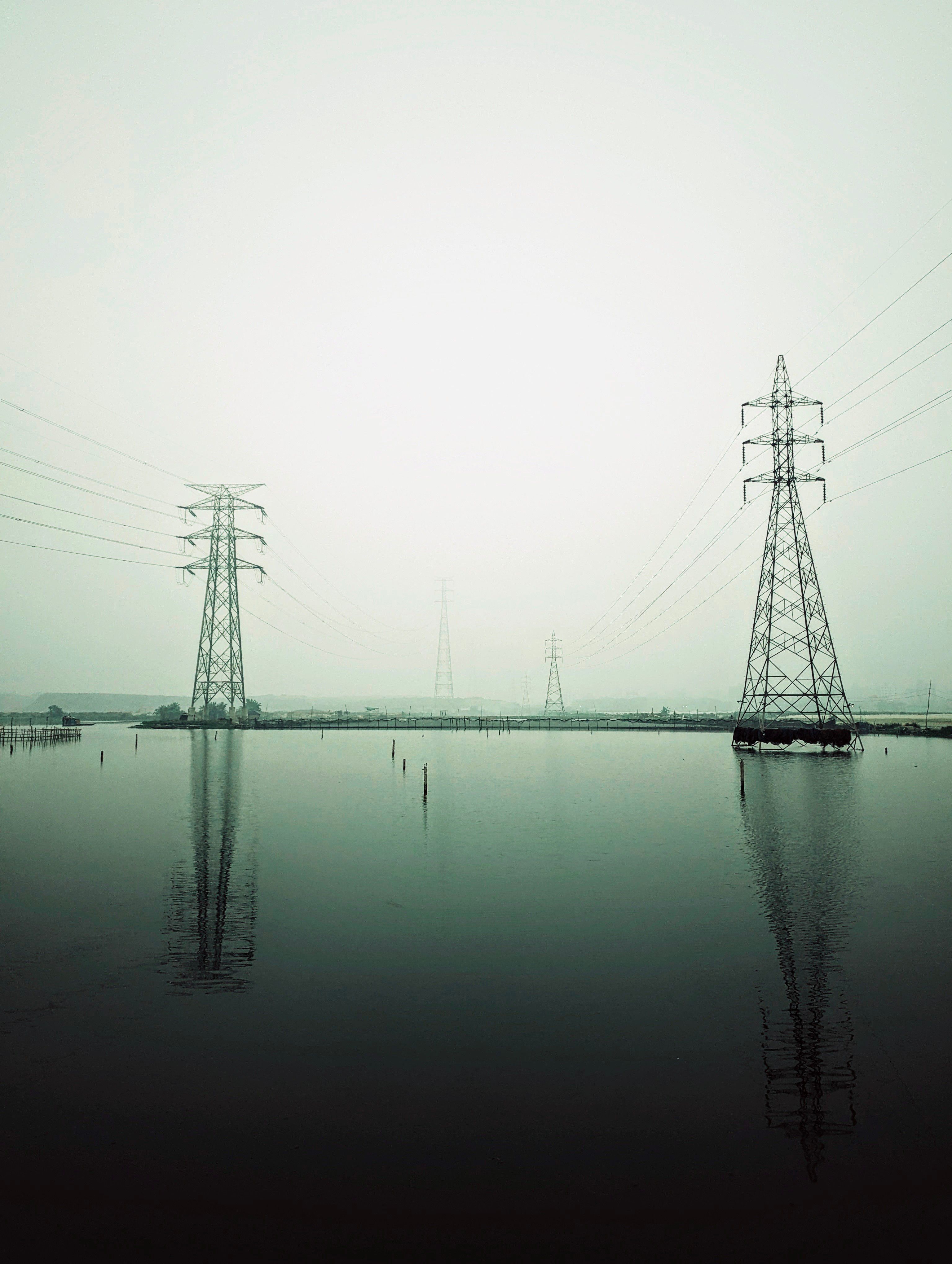 Electricity Towers by the Water · Free Stock Photo