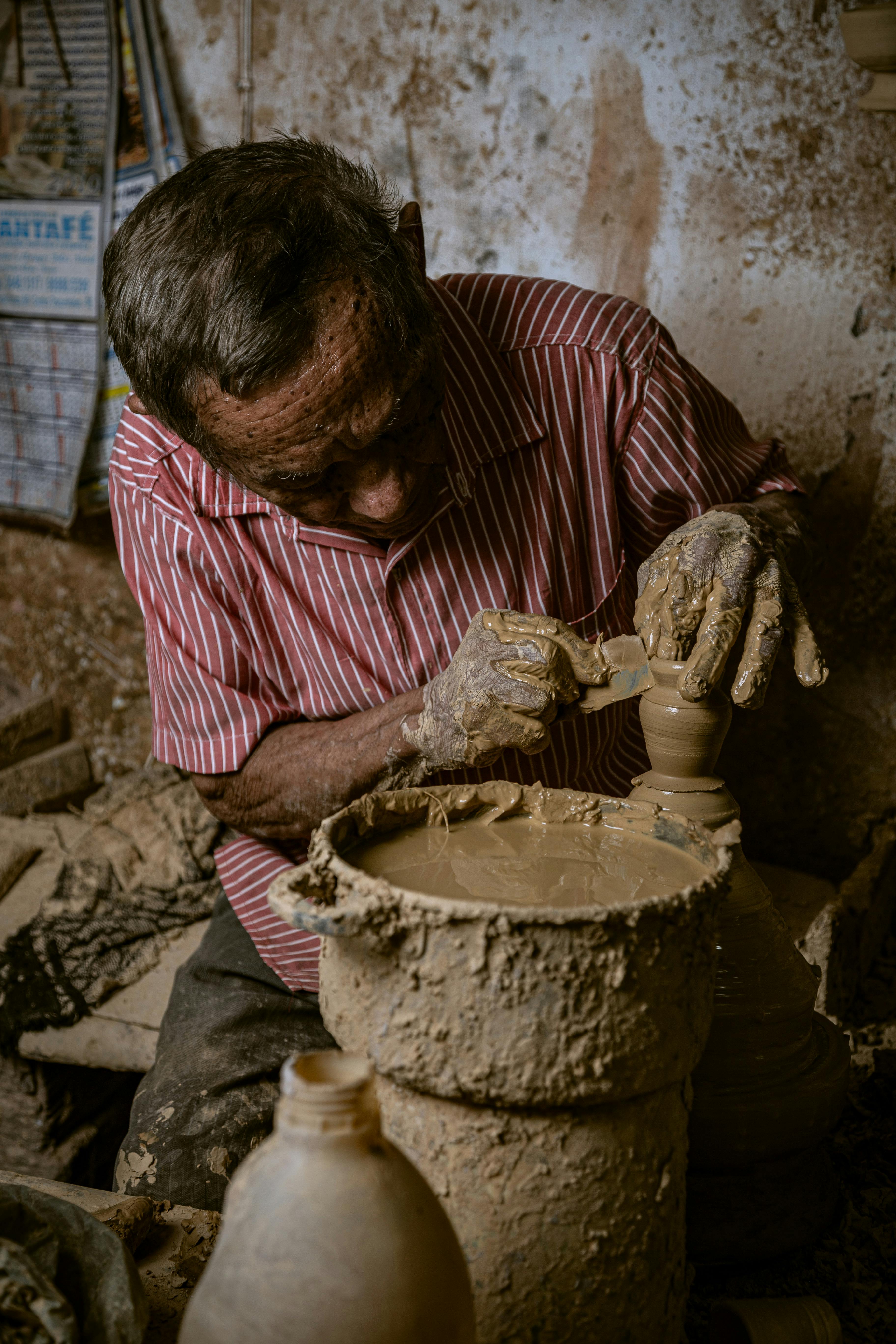 Photo of a Man Making a Clay Pot · Free Stock Photo
