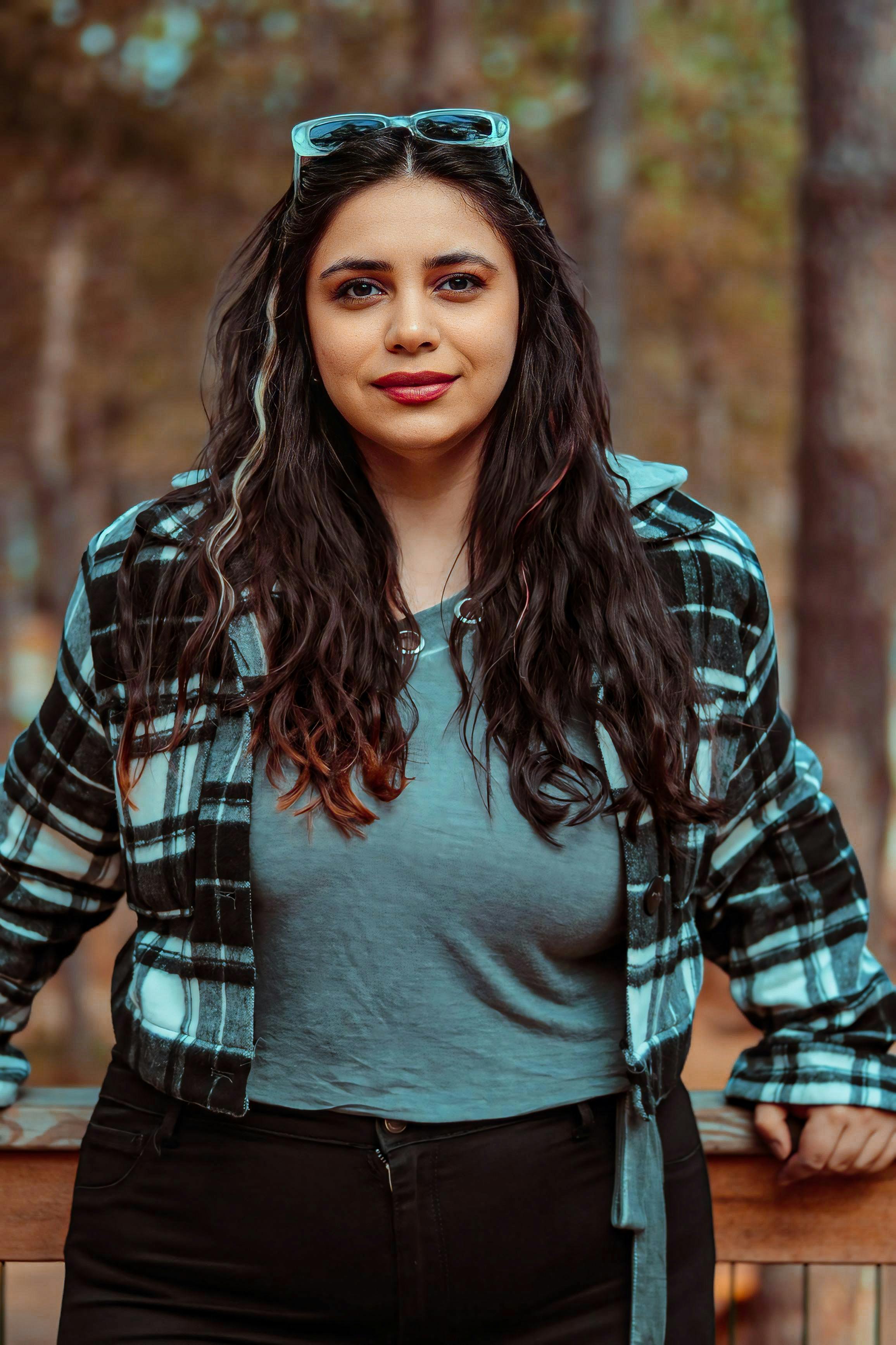 Standing Woman in Check Jacket · Free Stock Photo