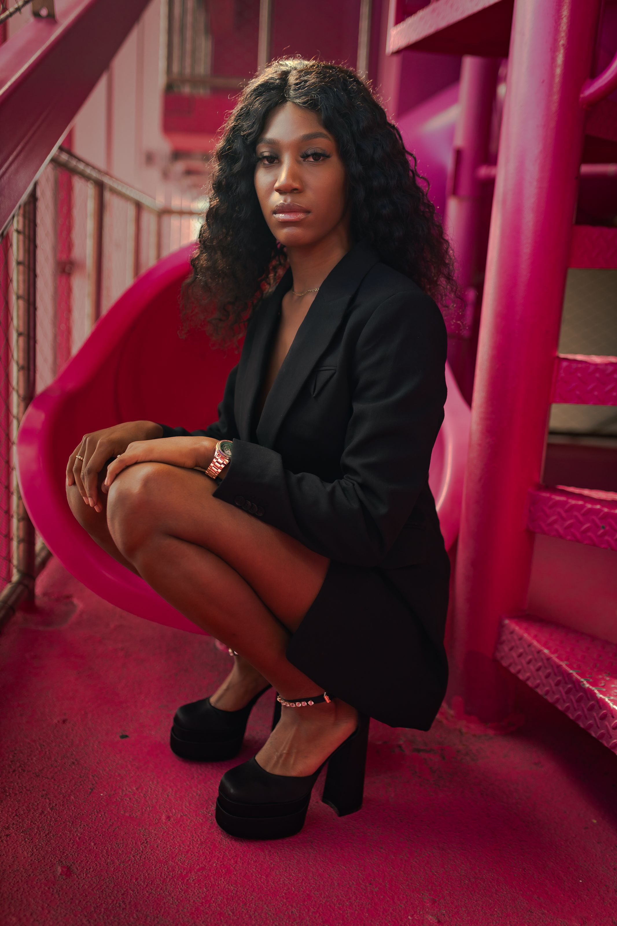 Crouching Woman in Black Jacket and Heels · Free Stock Photo