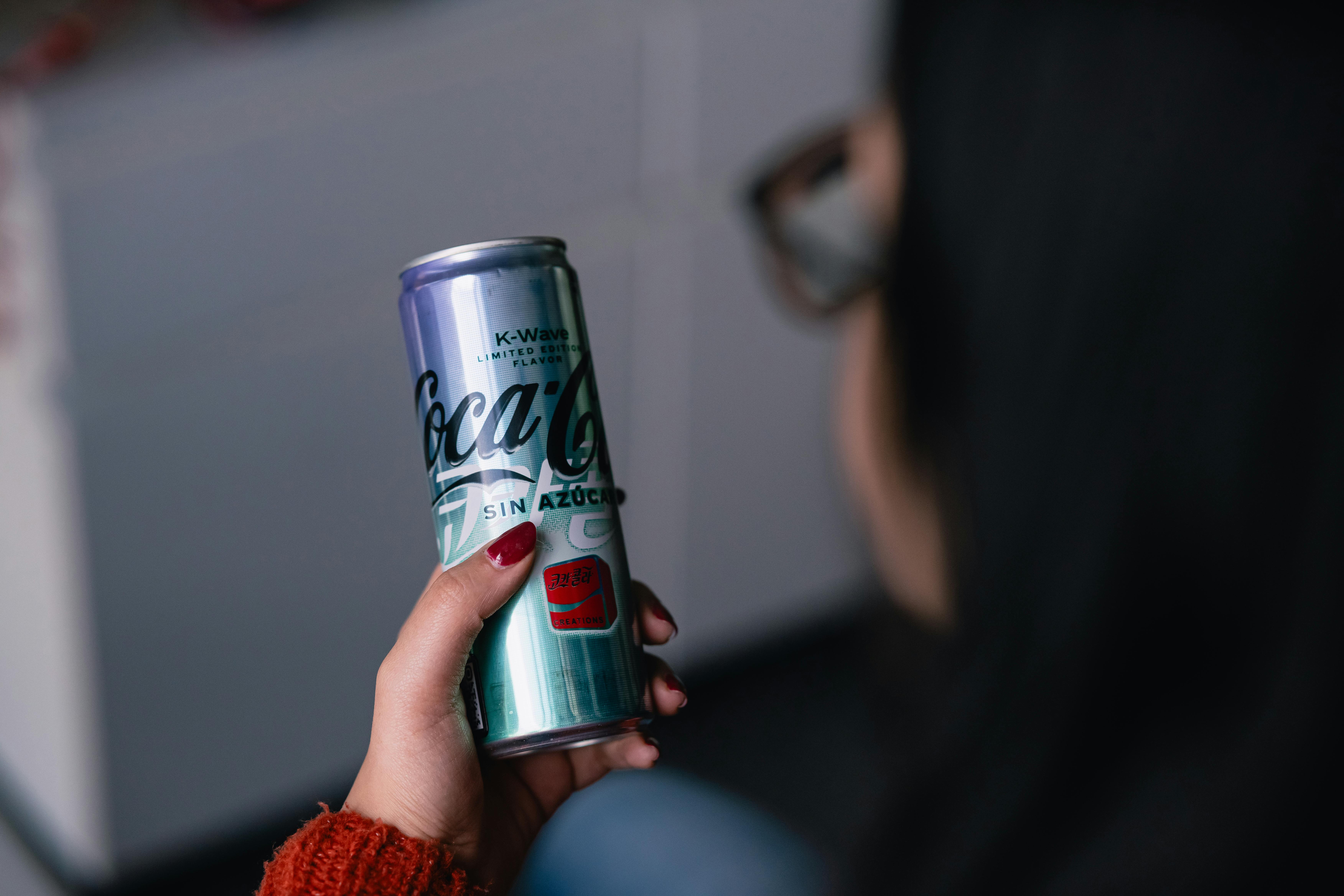 Female hand holds Coca - Cola zero sugar can K-wave · Free Stock Photo