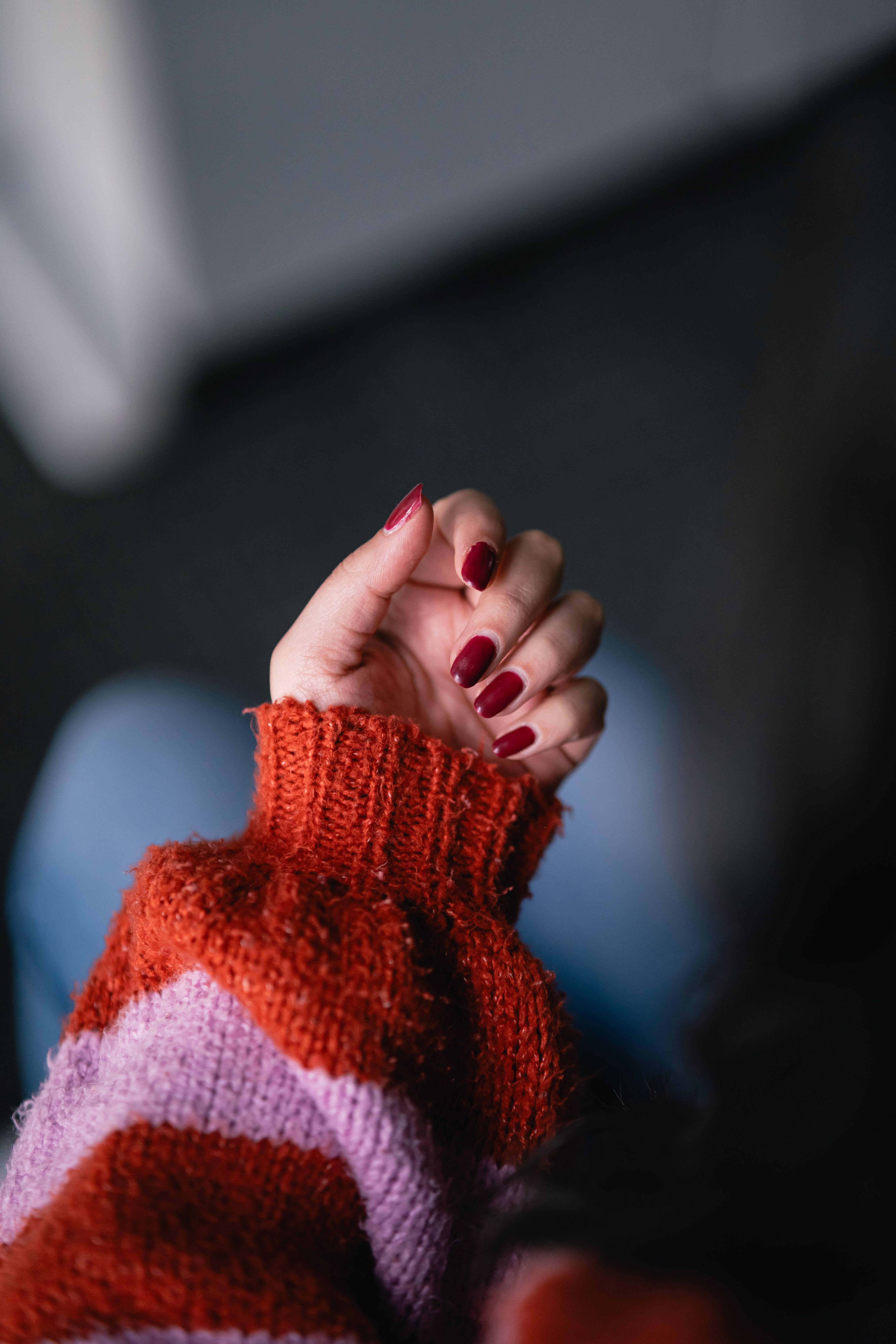 Womans Hand with Red Nails · Free Stock Photo