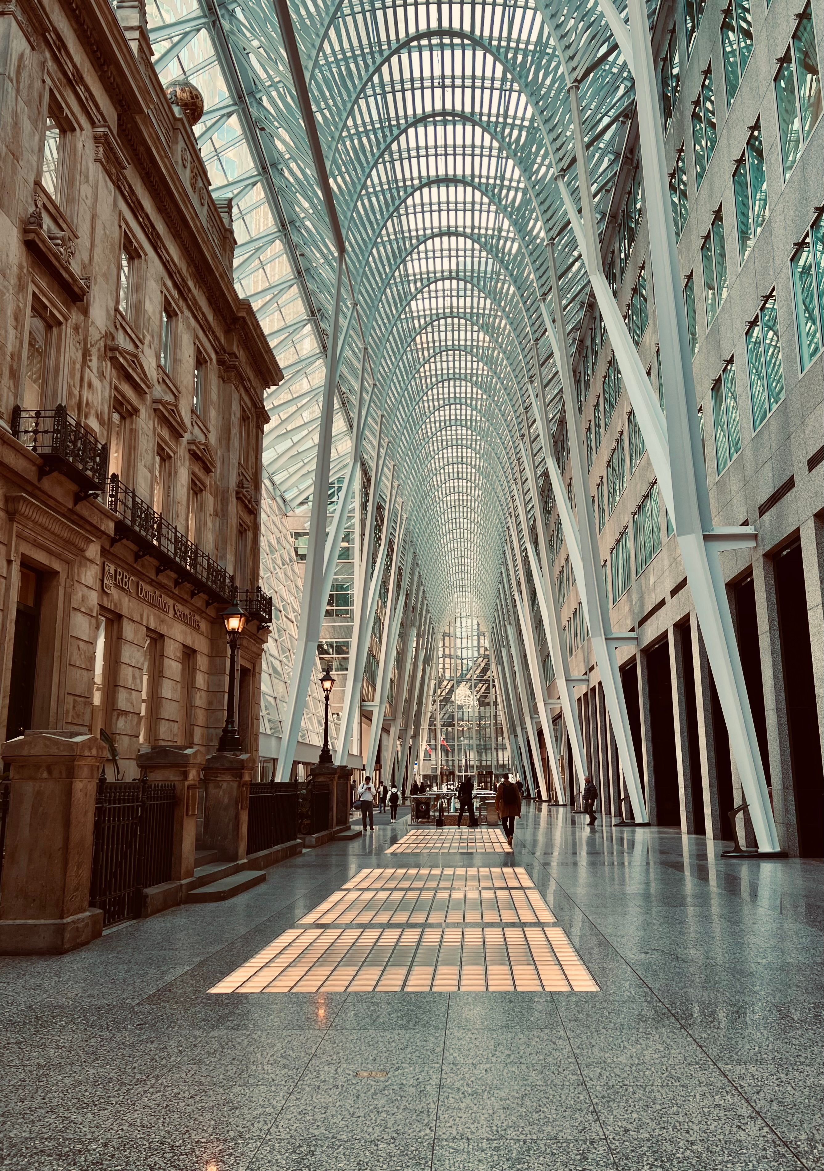 People Walking Inside Glass Building · Free Stock Photo
