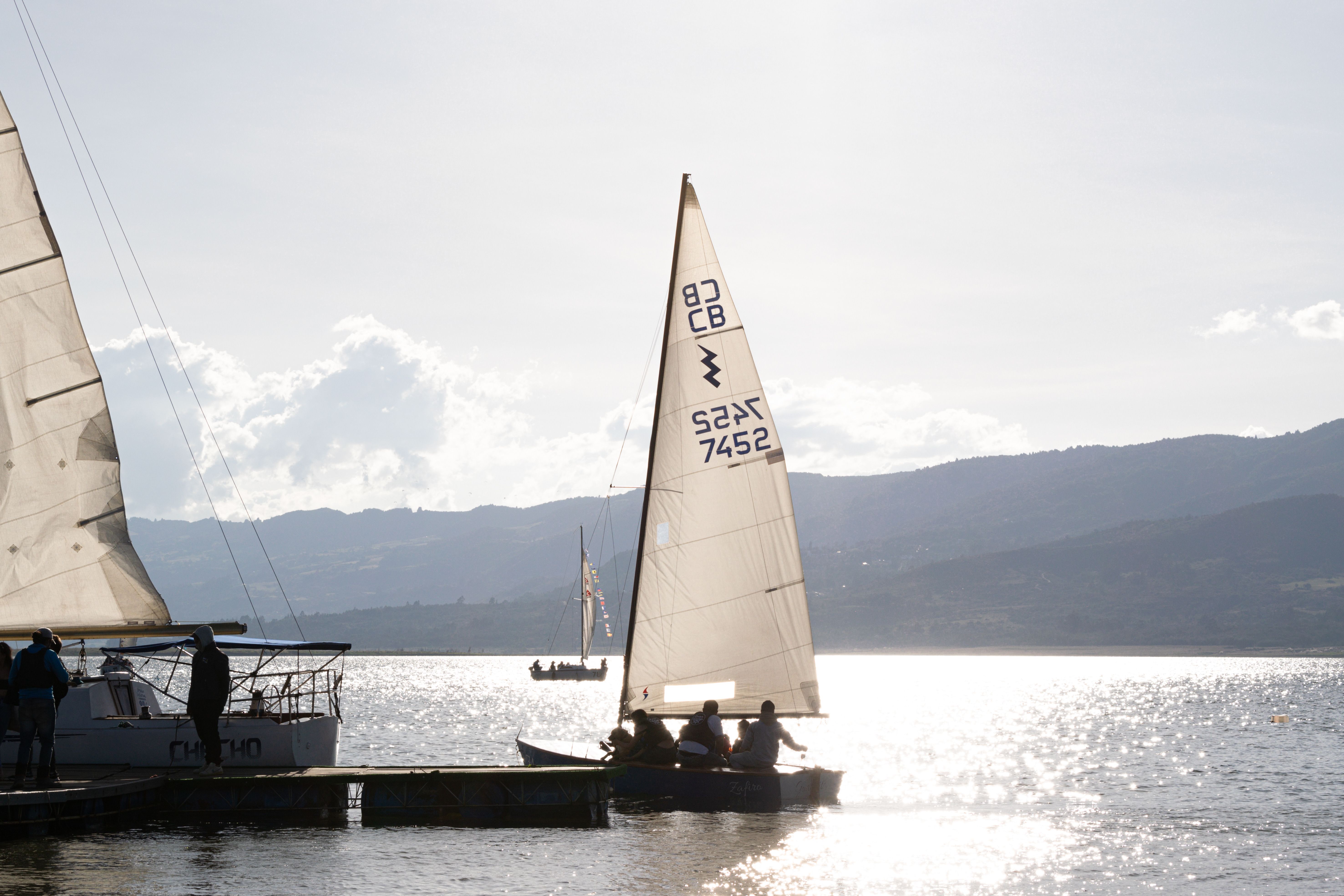 Sailboat Moored on Boardwalk on Coast · Free Stock Photo