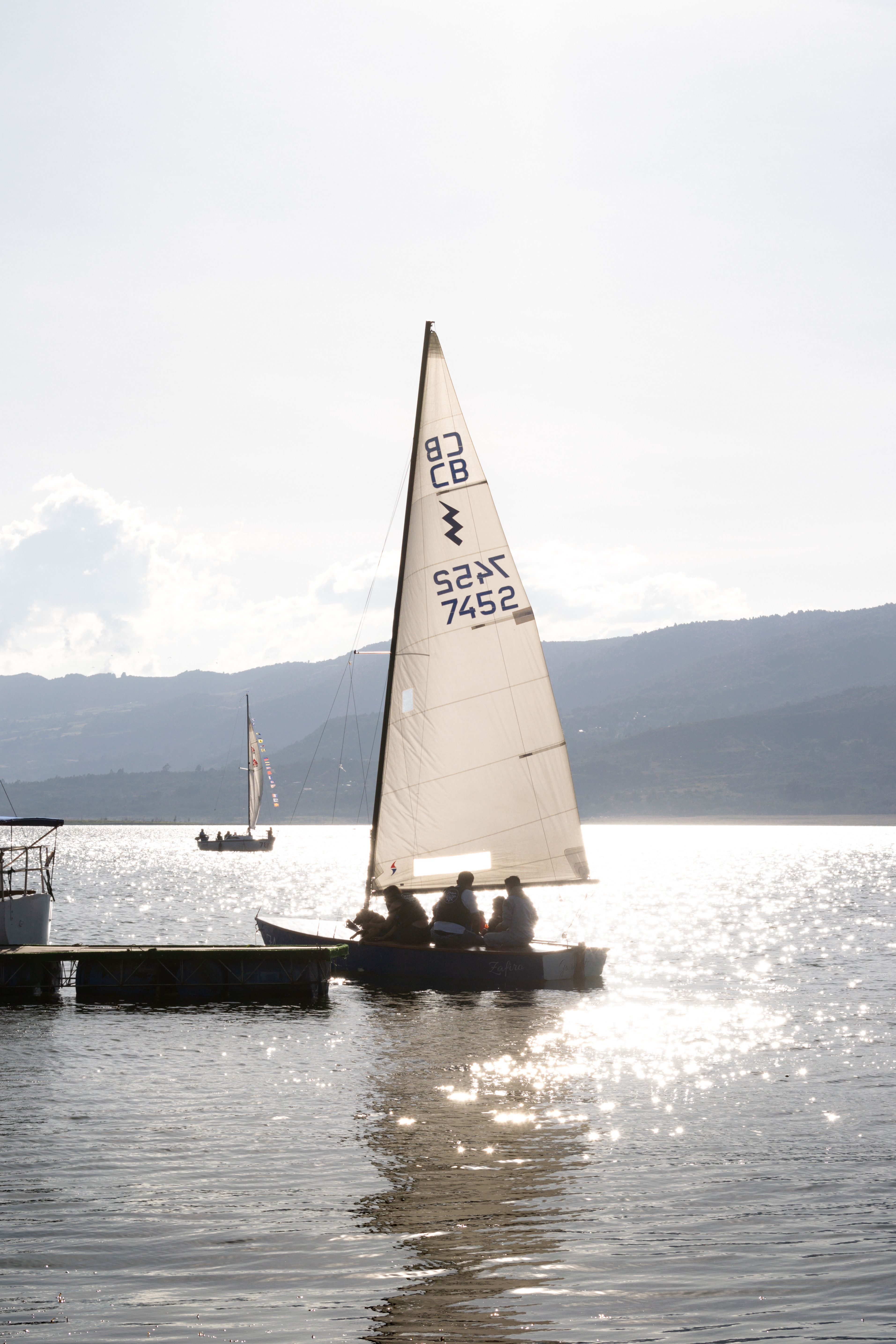 Sailboat on Sea Coast · Free Stock Photo