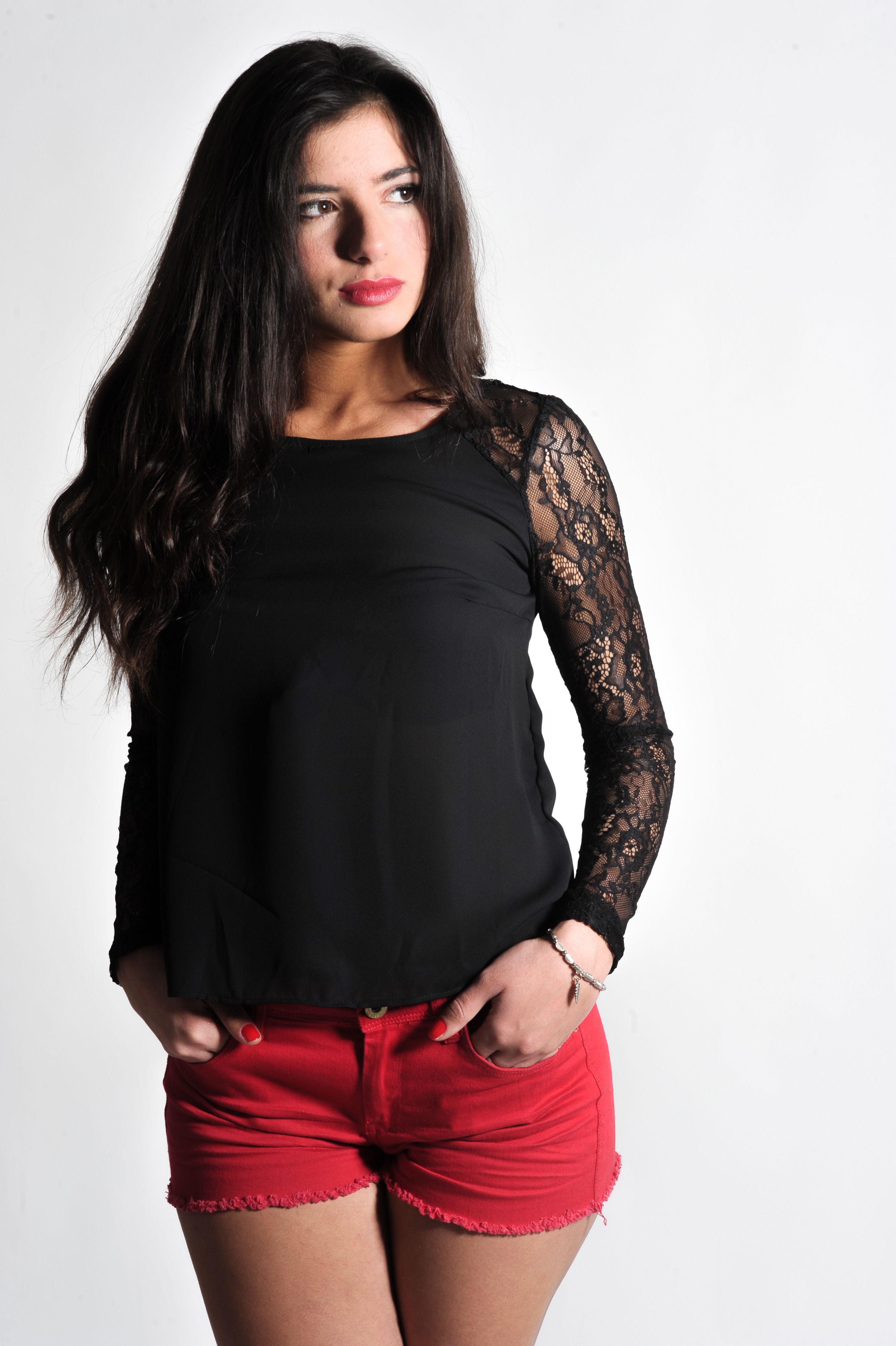 A woman in red shorts and a black top · Free Stock Photo