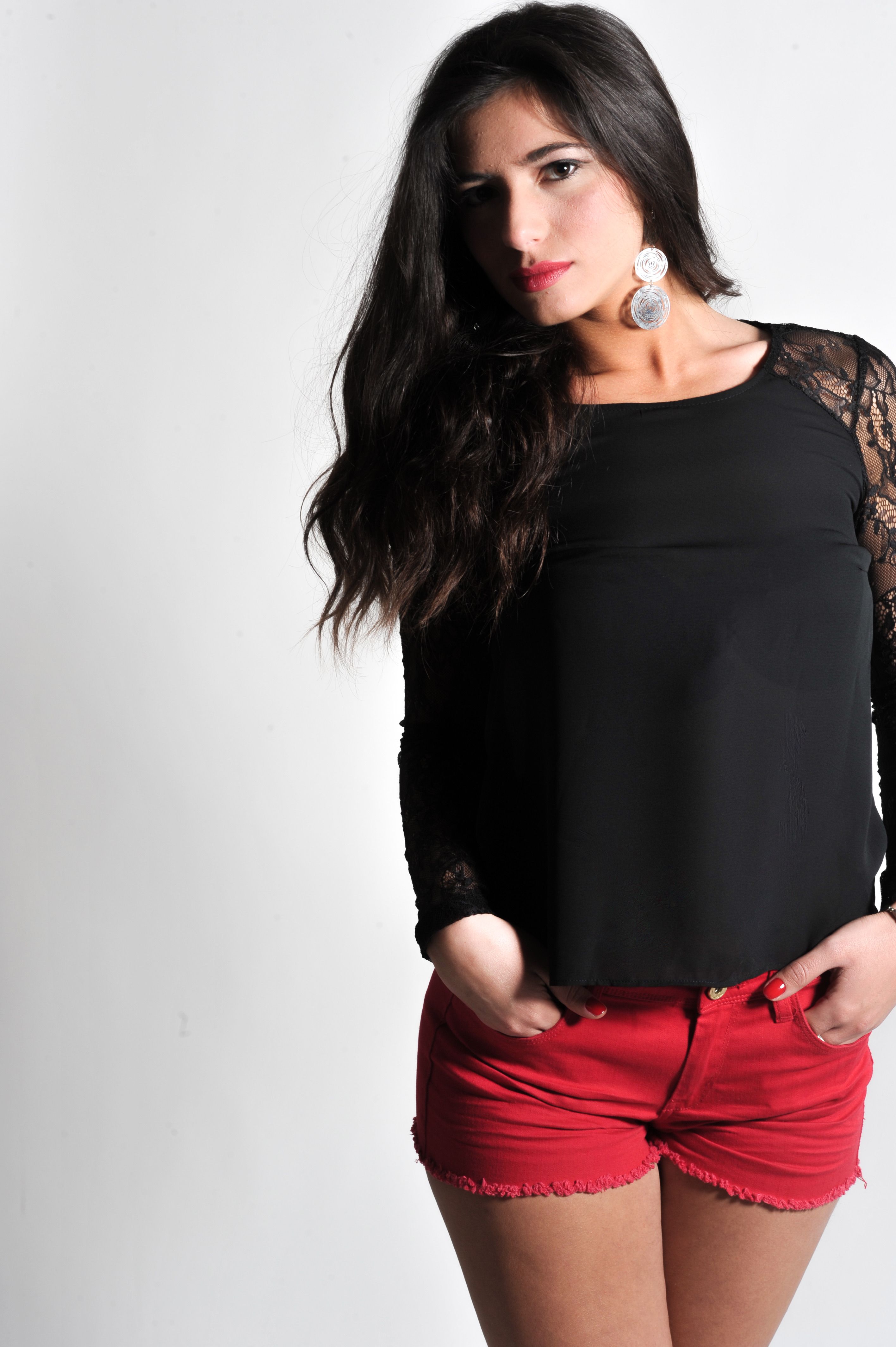 A woman in red shorts and a black top · Free Stock Photo