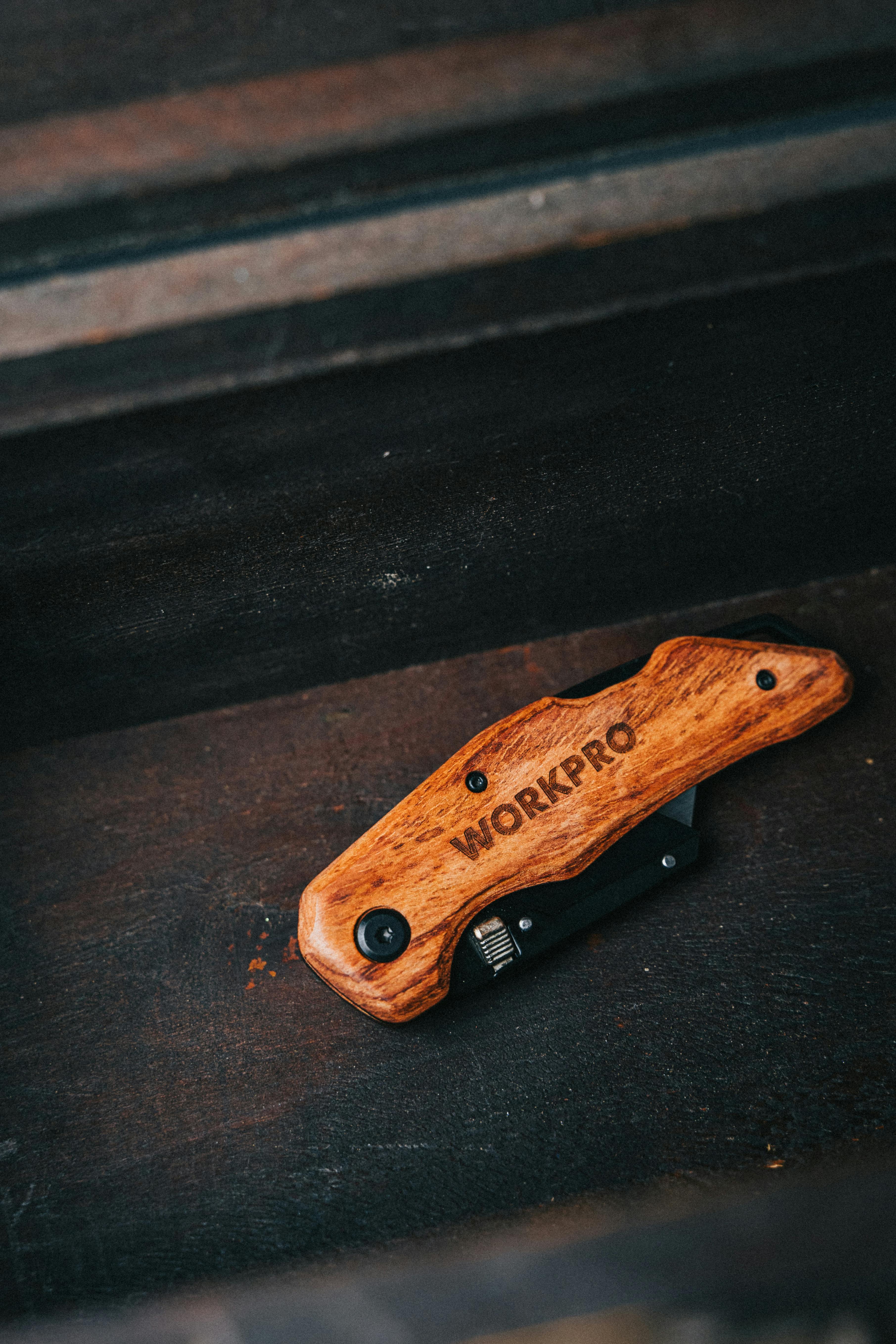 Close-up of a Multitool with a Wooden Handle · Free Stock Photo