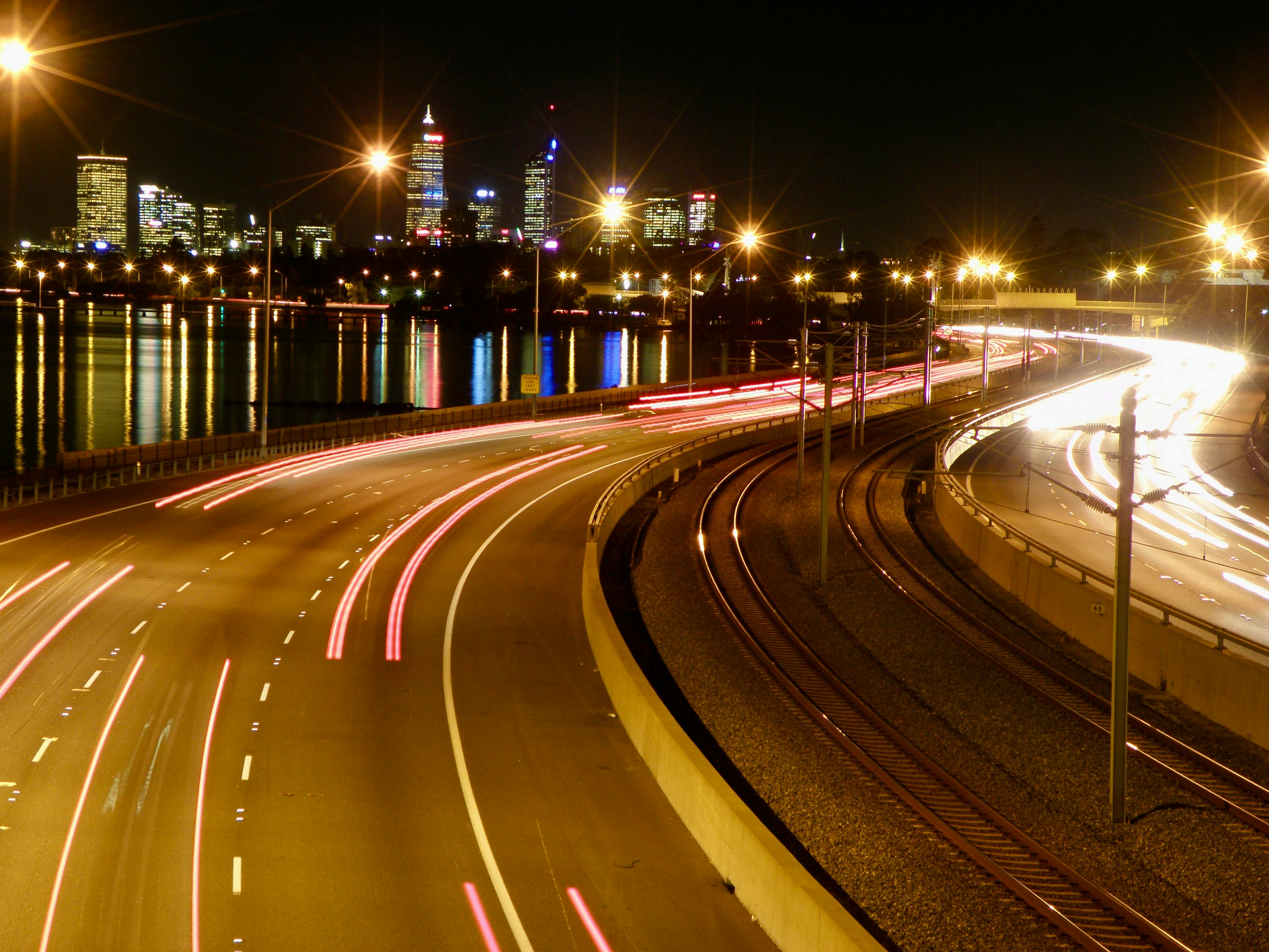 Street along Tracks at Night · Free Stock Photo