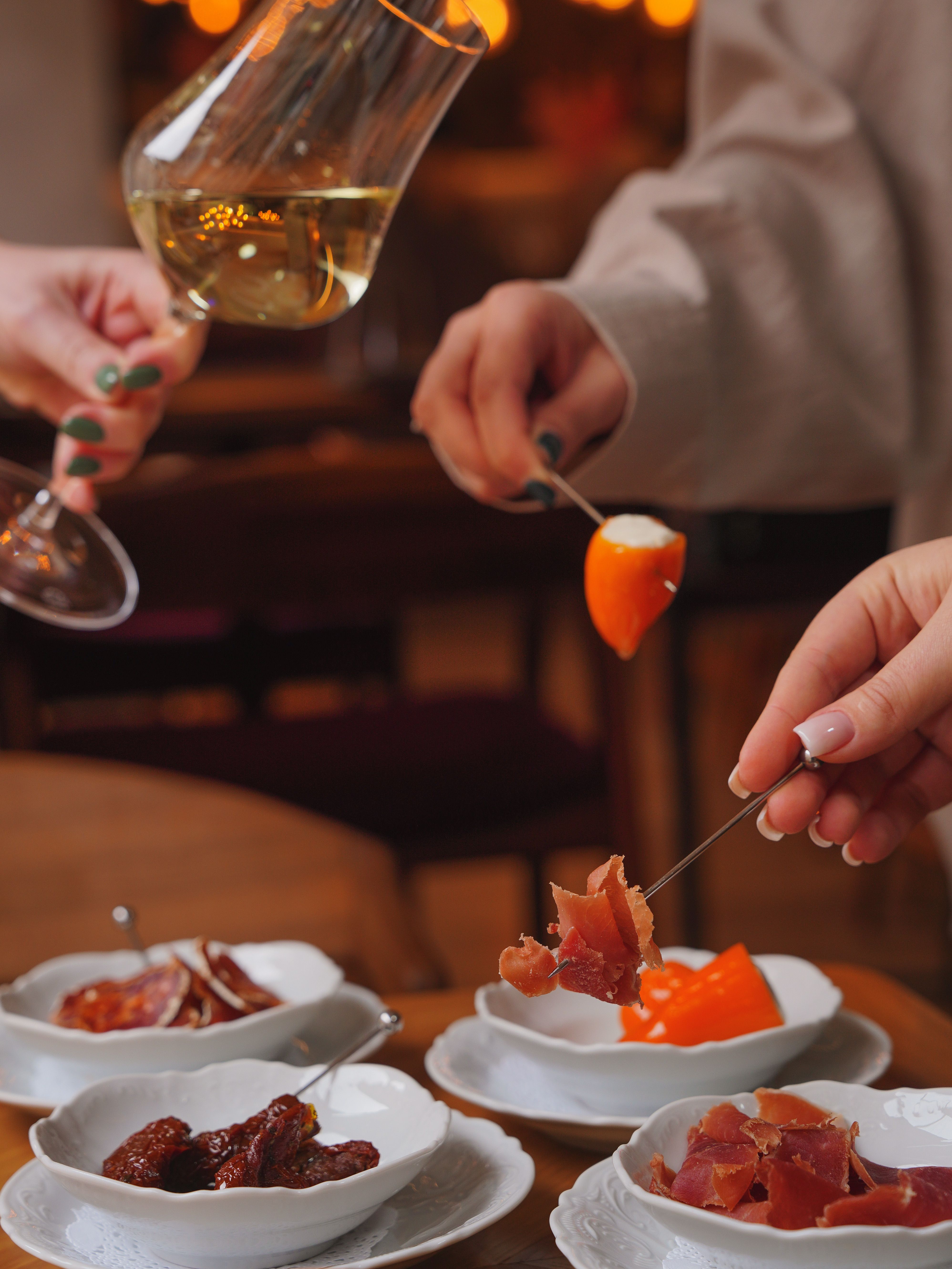 People by Table with Appetizers · Free Stock Photo