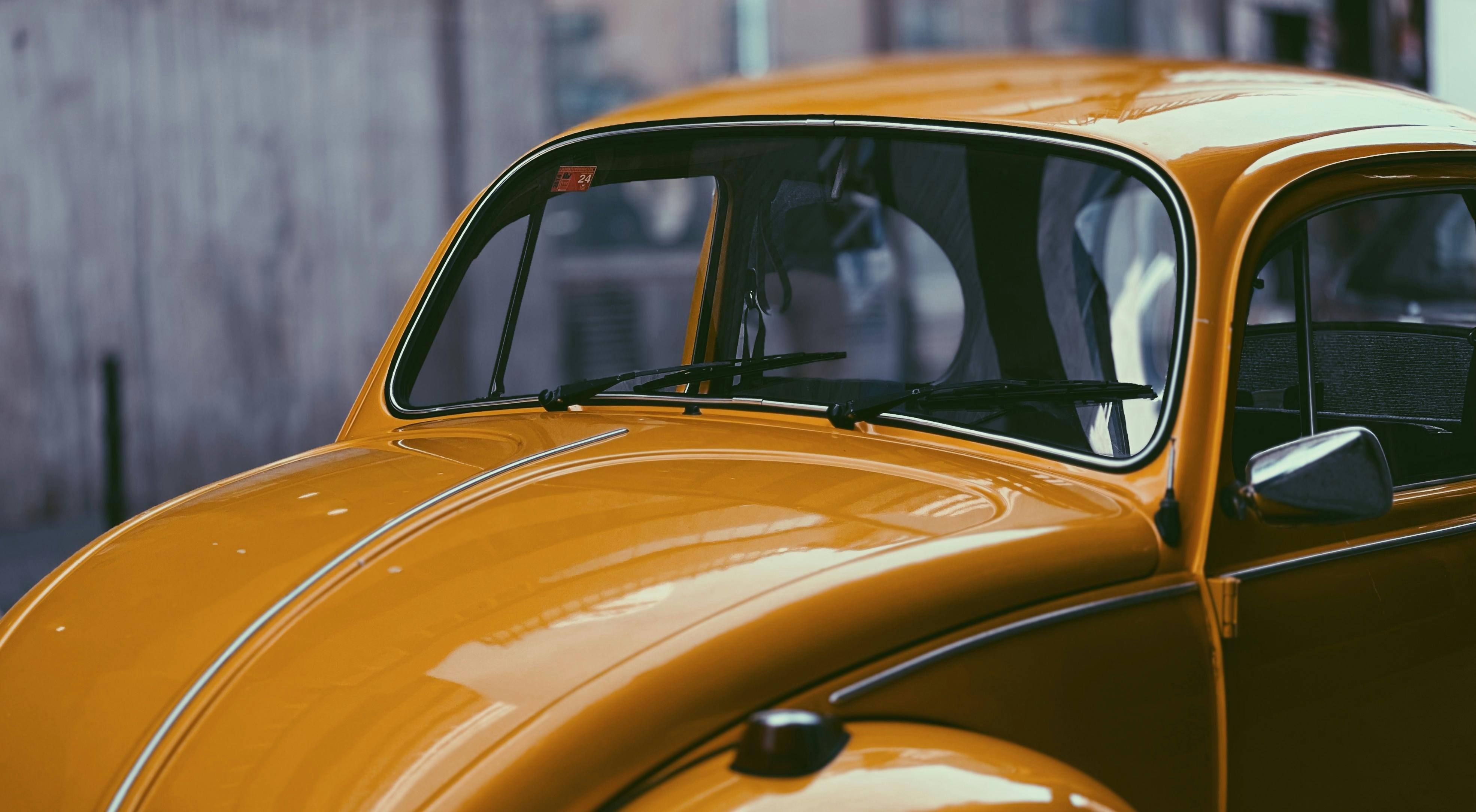 Part of a Yellow Volkswagen Beetle · Free Stock Photo