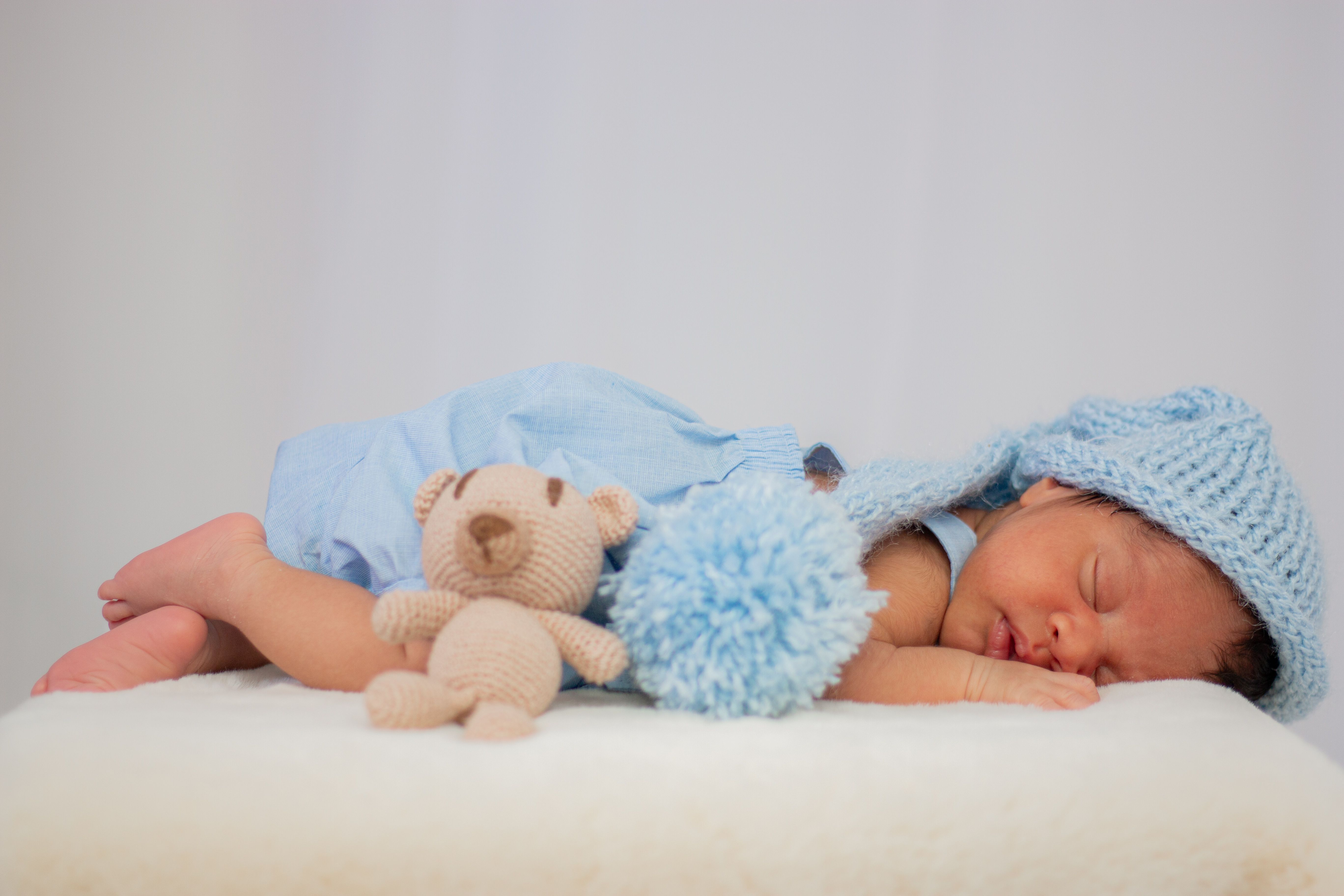 A Newborn with a Teddy Bear · Free Stock Photo