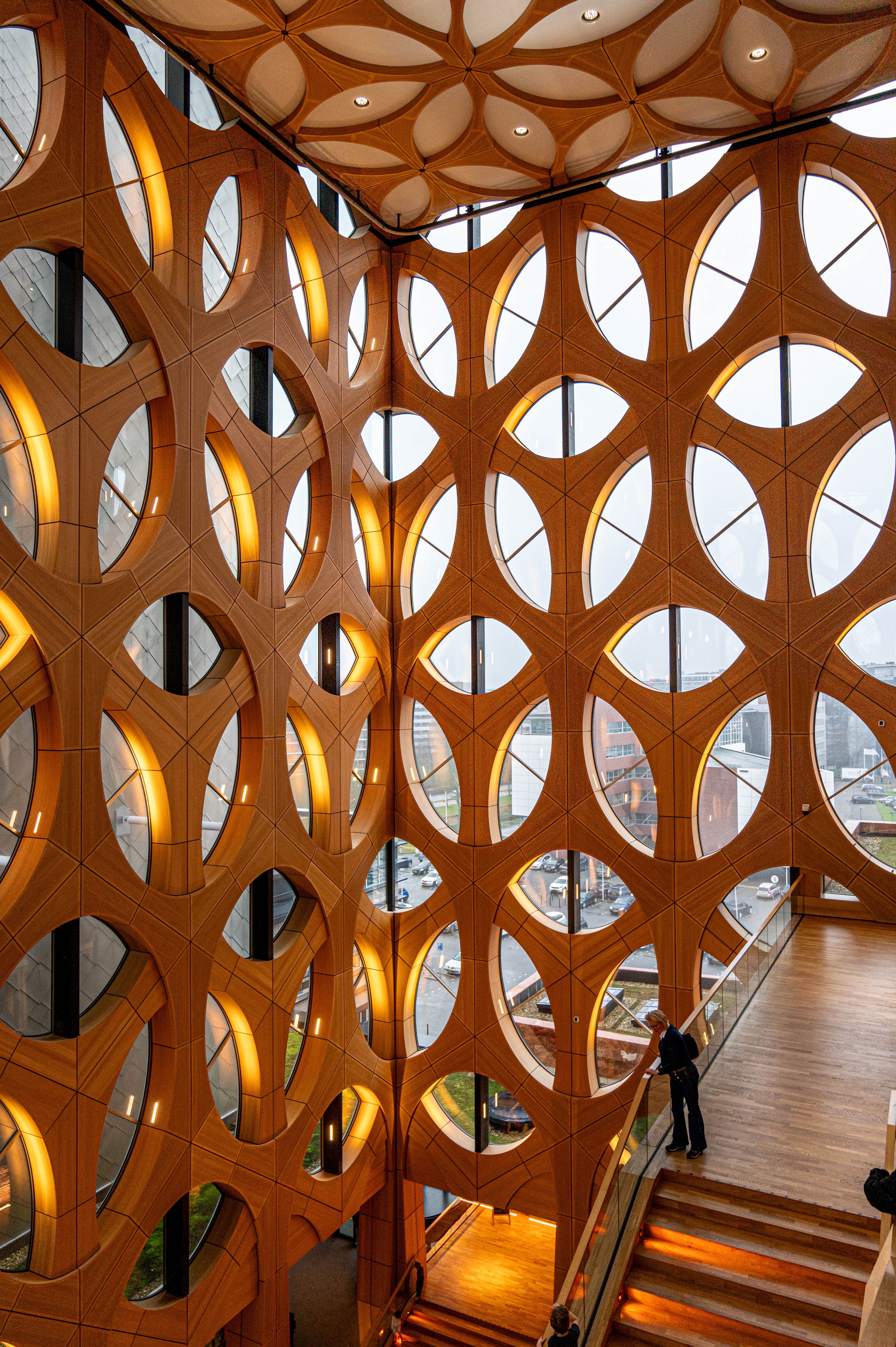 The inside of a building with a large wooden structure · Free Stock Photo