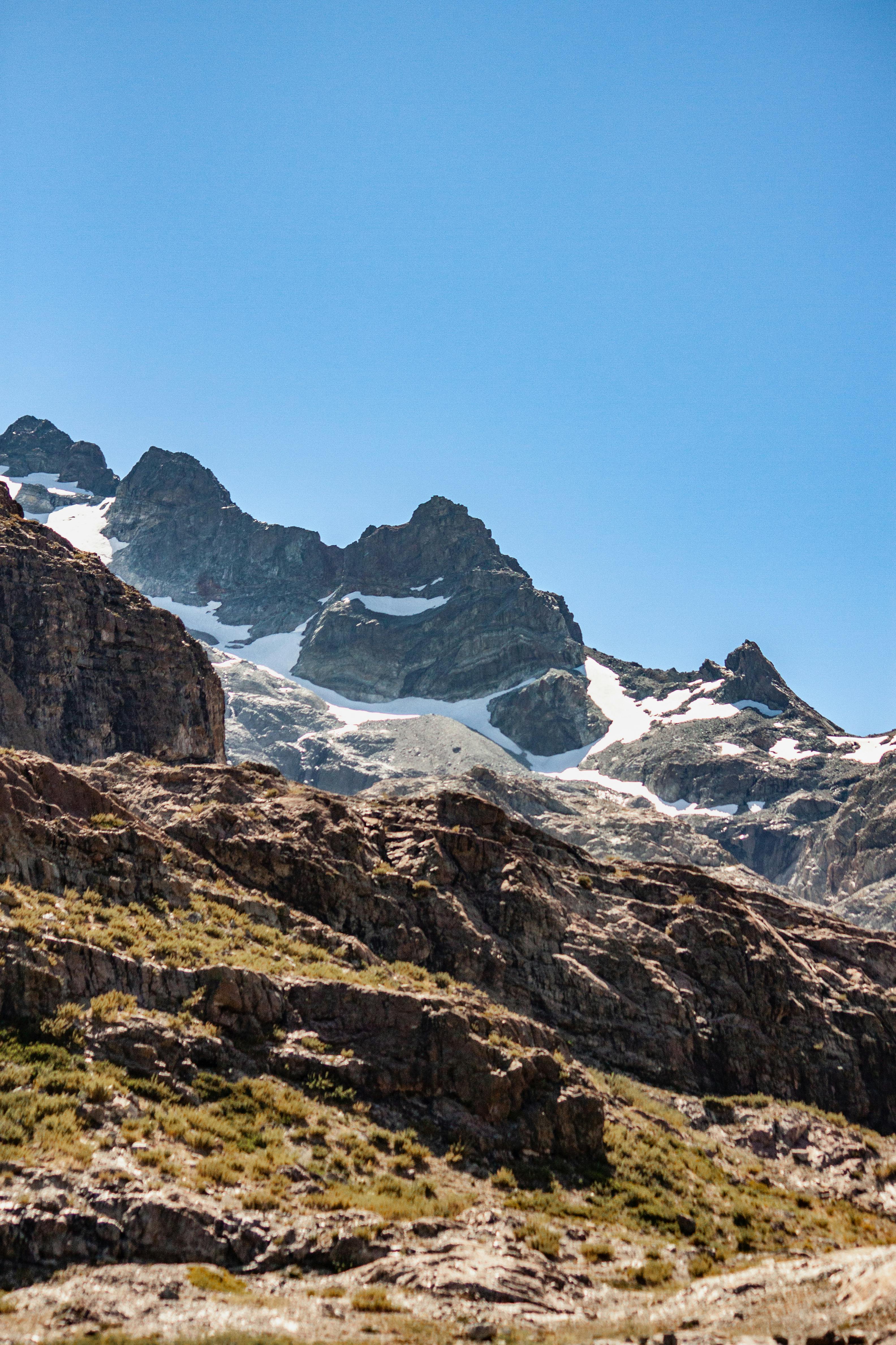 Snow on Rugged Mountain Range · Free Stock Photo