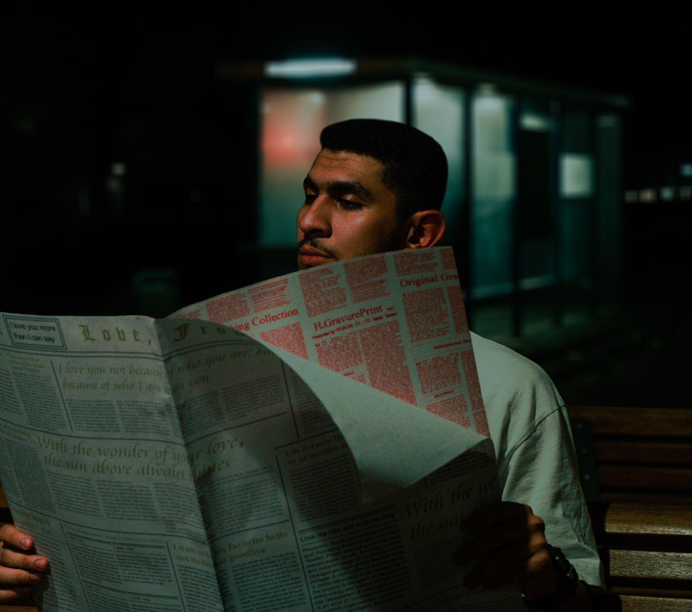 Man Reading Newspaper at Night · Free Stock Photo