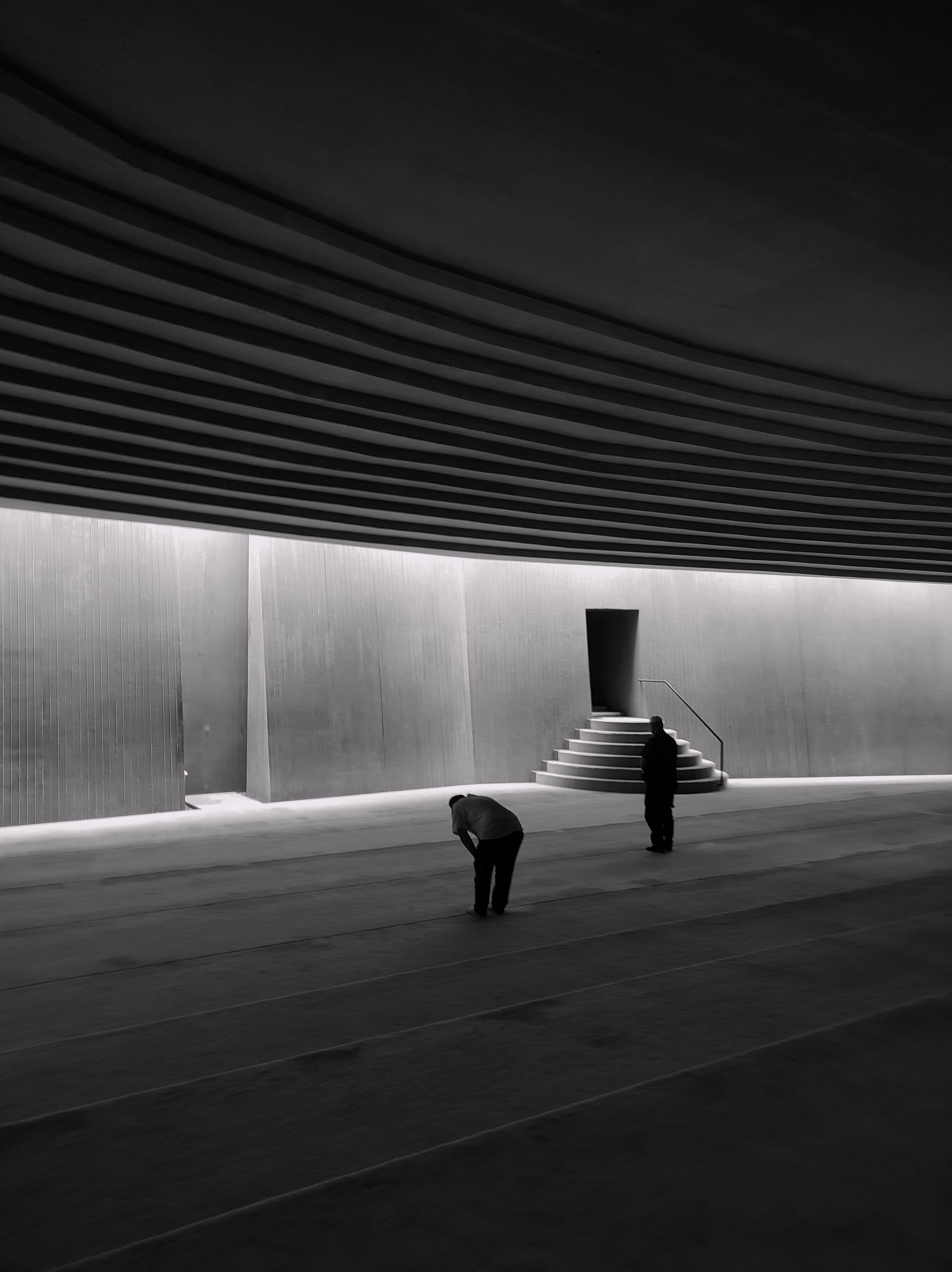 Men Standing and Bending near Building in Black and White · Free Stock ...