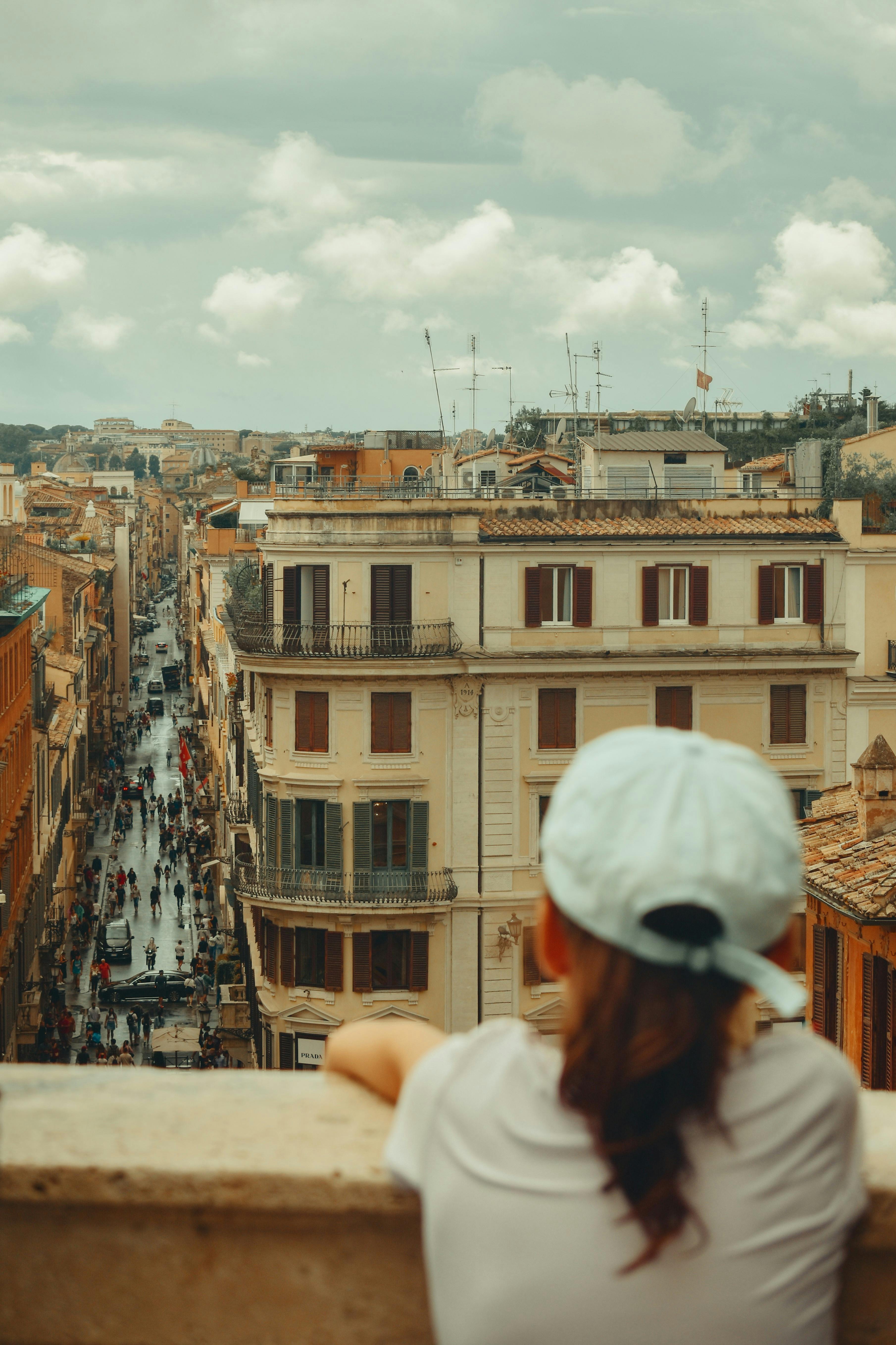 A woman looking out over the city · Free Stock Photo