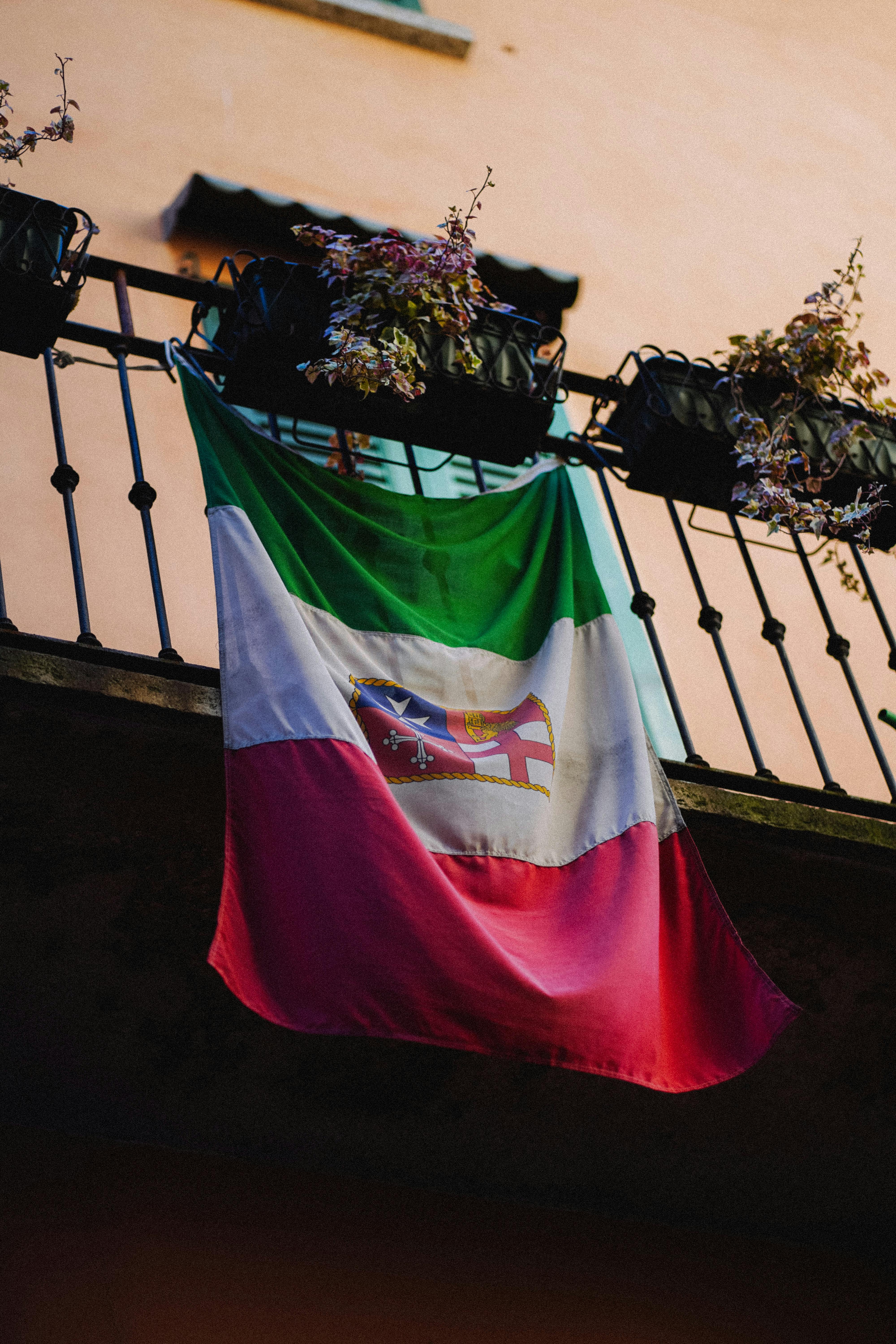 Italian Naval Flag Hanging from a Balcony · Free Stock Photo