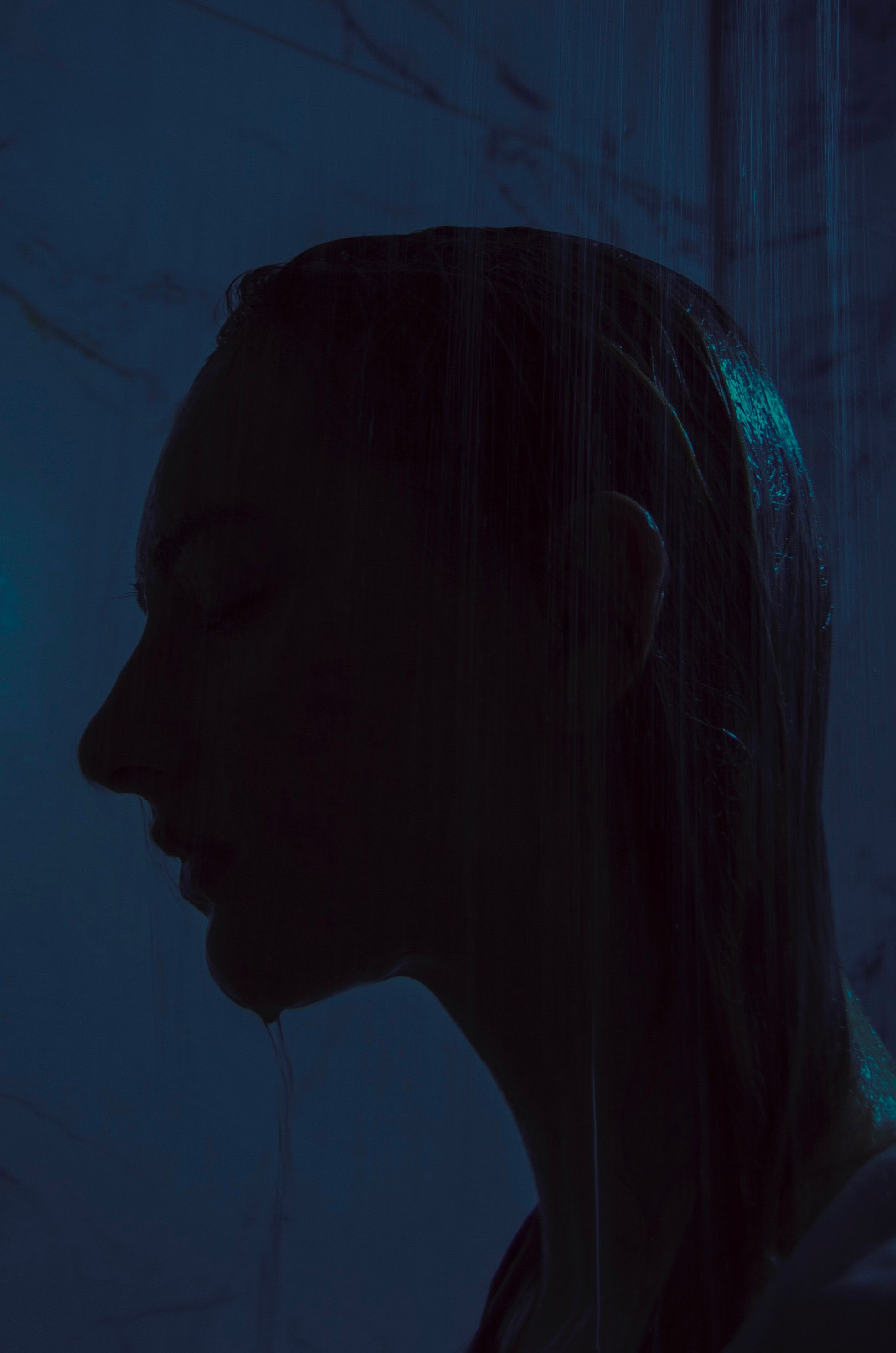 Silhouette of Person with Water Dripping down their Face · Free Stock Photo