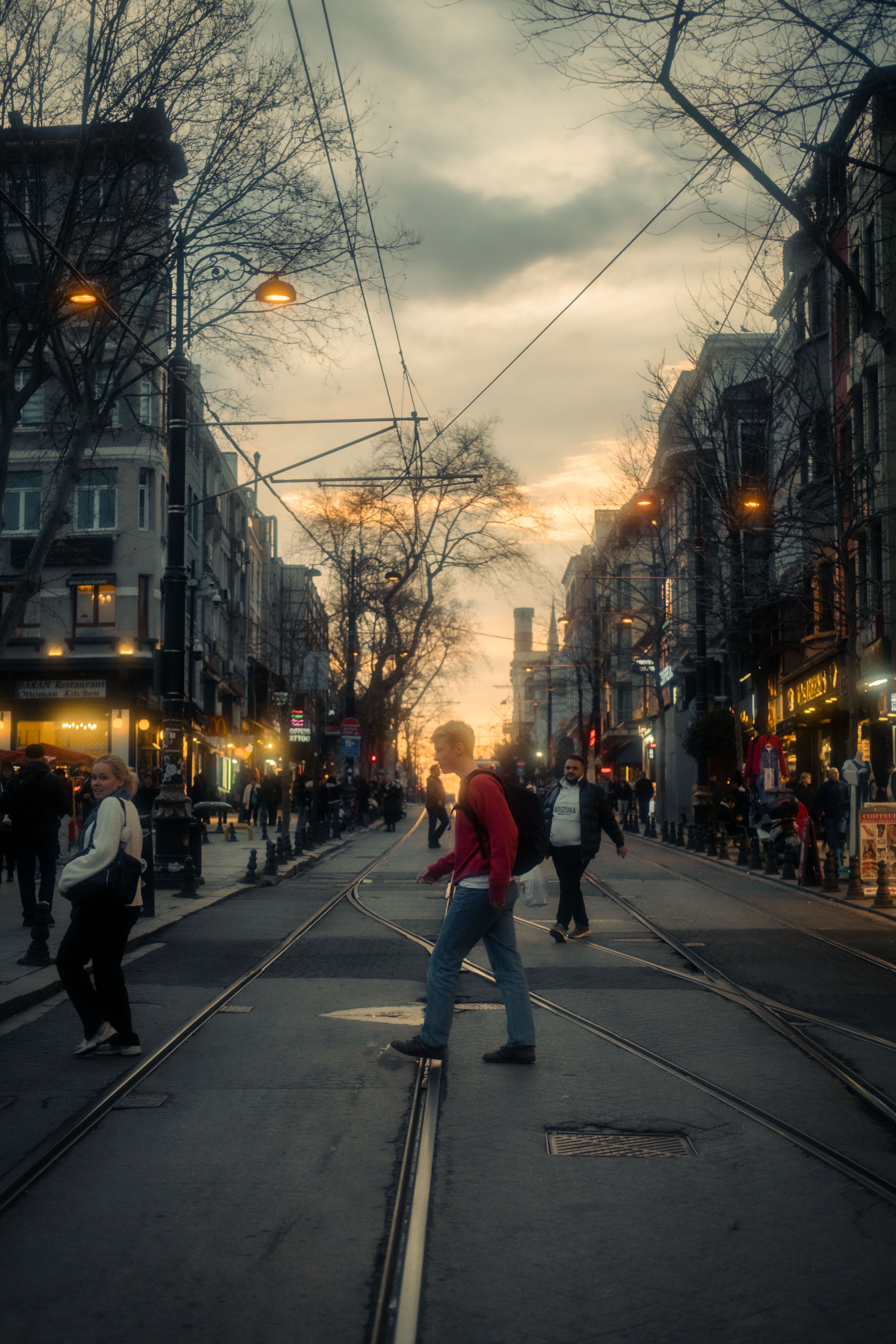 People Crossing City Street at Sunset · Free Stock Photo