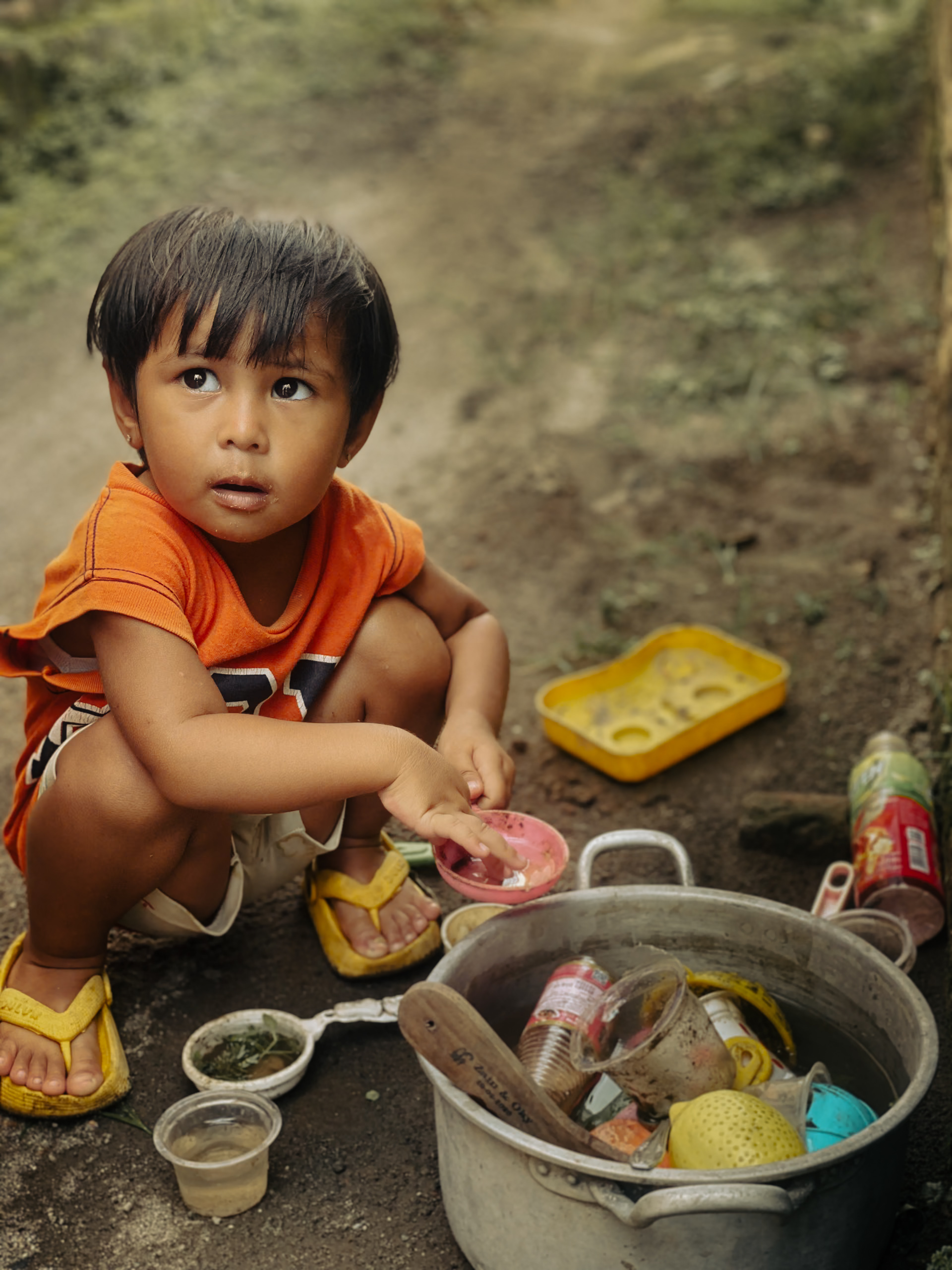 Kid and Bucket on a Ground · Free Stock Photo