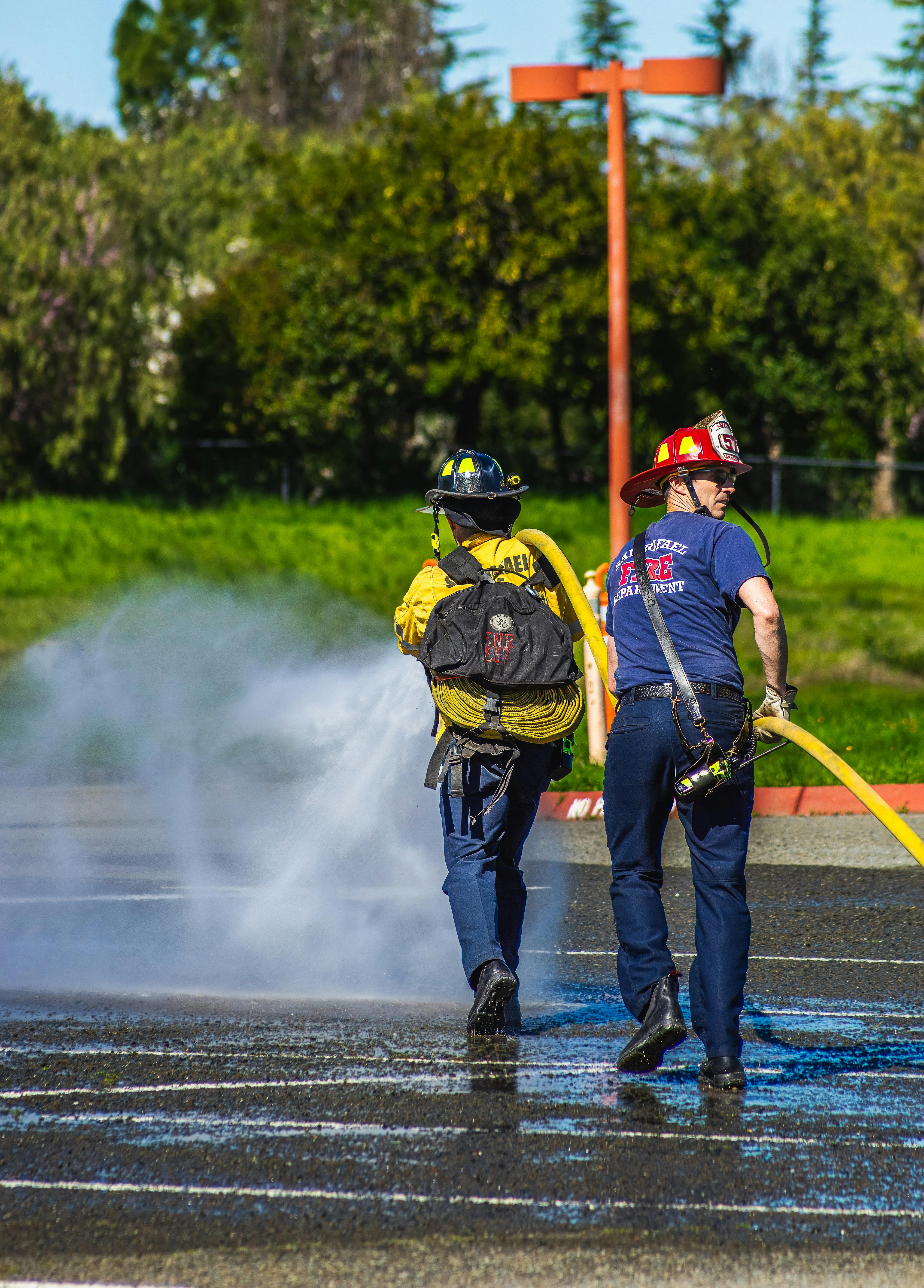 Firefighters Working at Parking Lot · Free Stock Photo