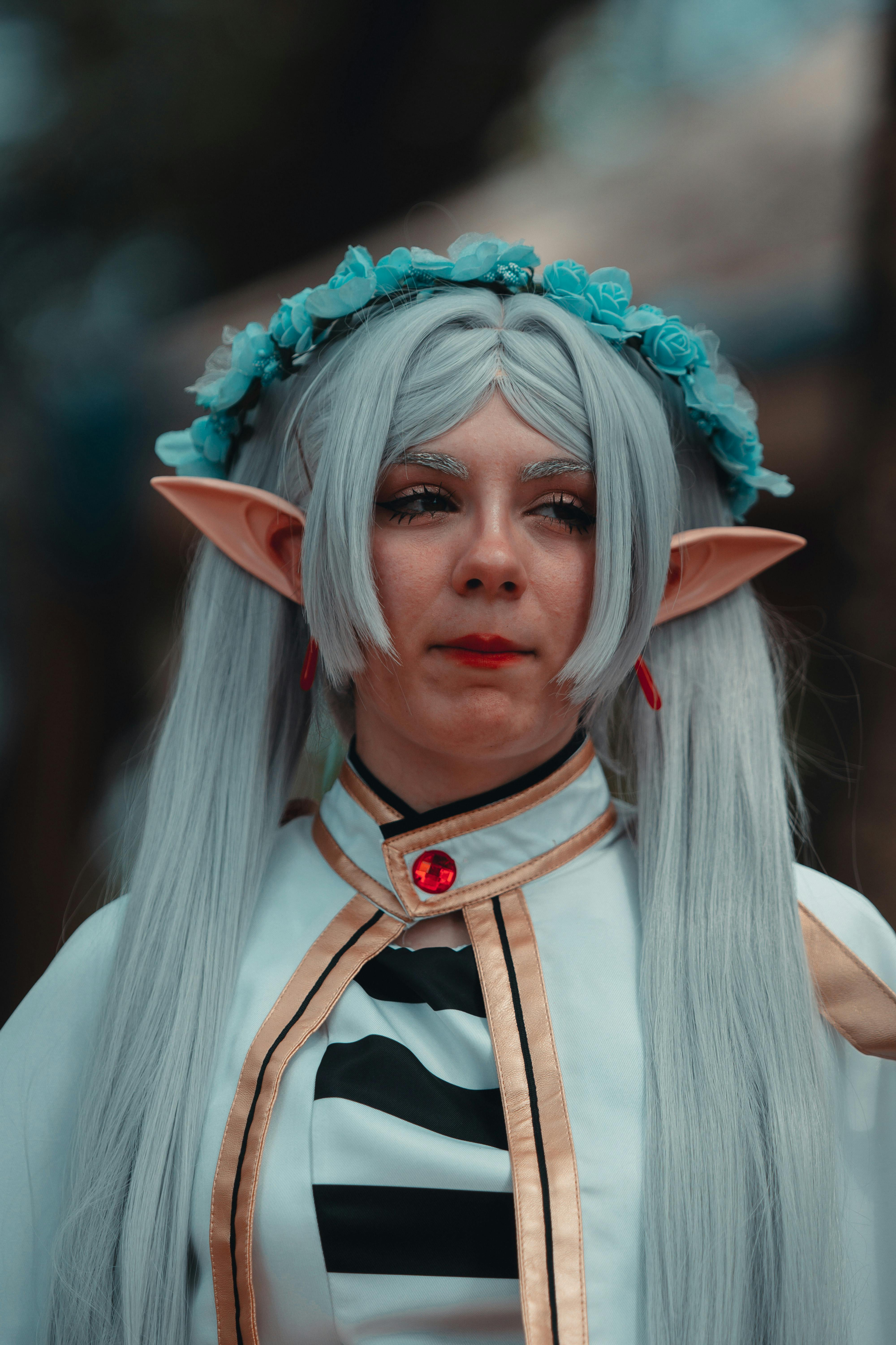 An Elf Peeking in Between Tree Trunks · Free Stock Photo