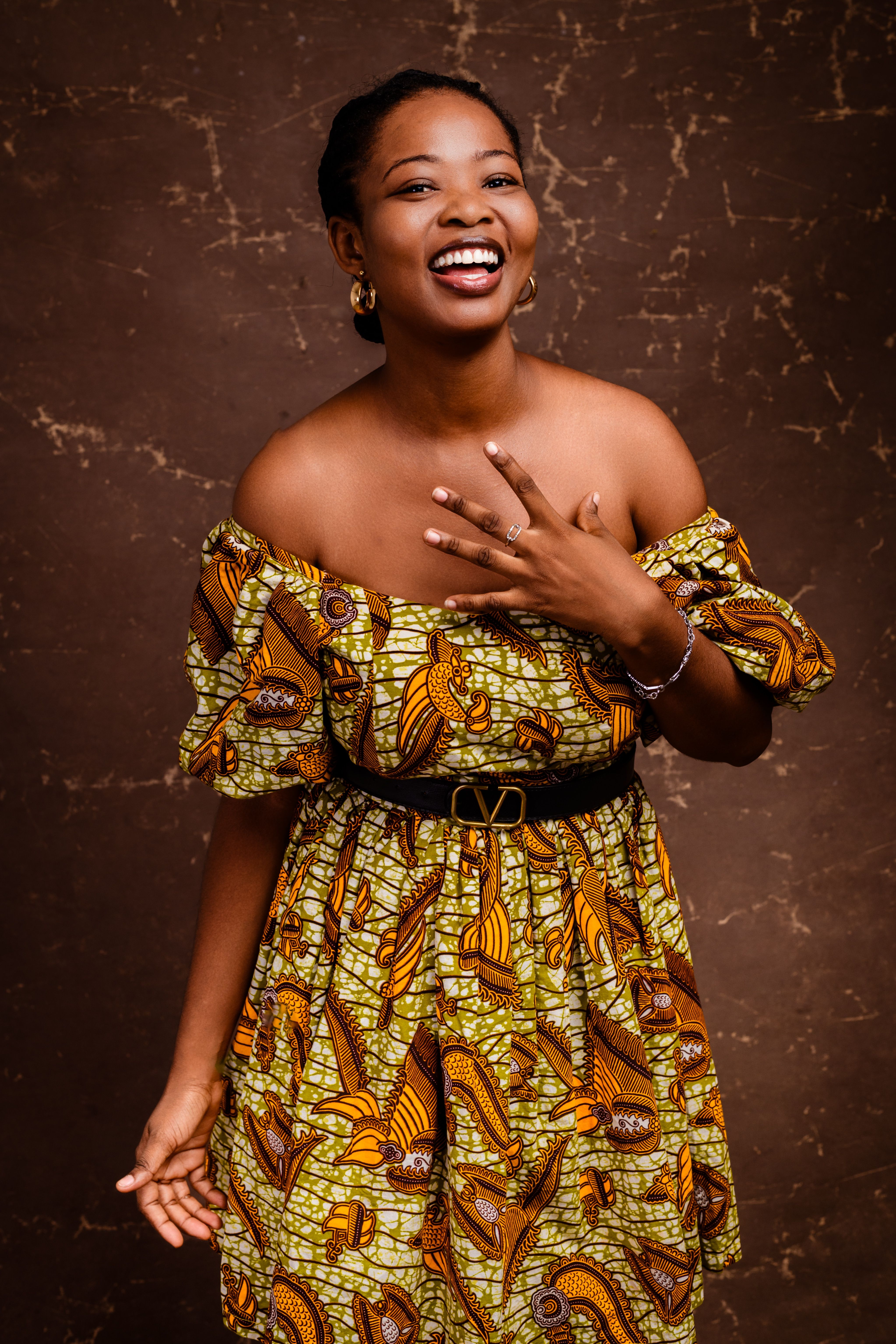Cheerful Model in Patterned Dress · Free Stock Photo