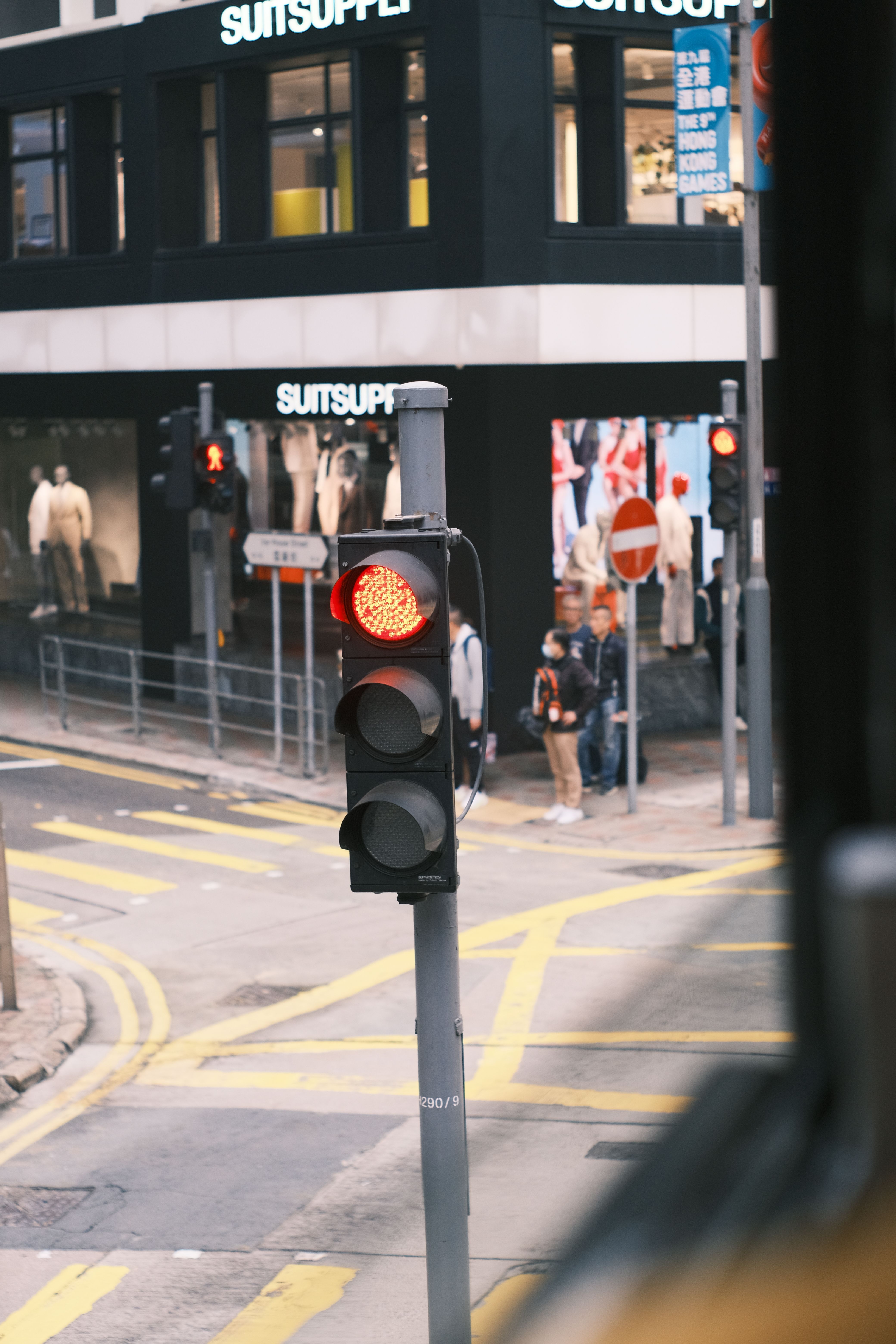 A red traffic light on a street corner · Free Stock Photo