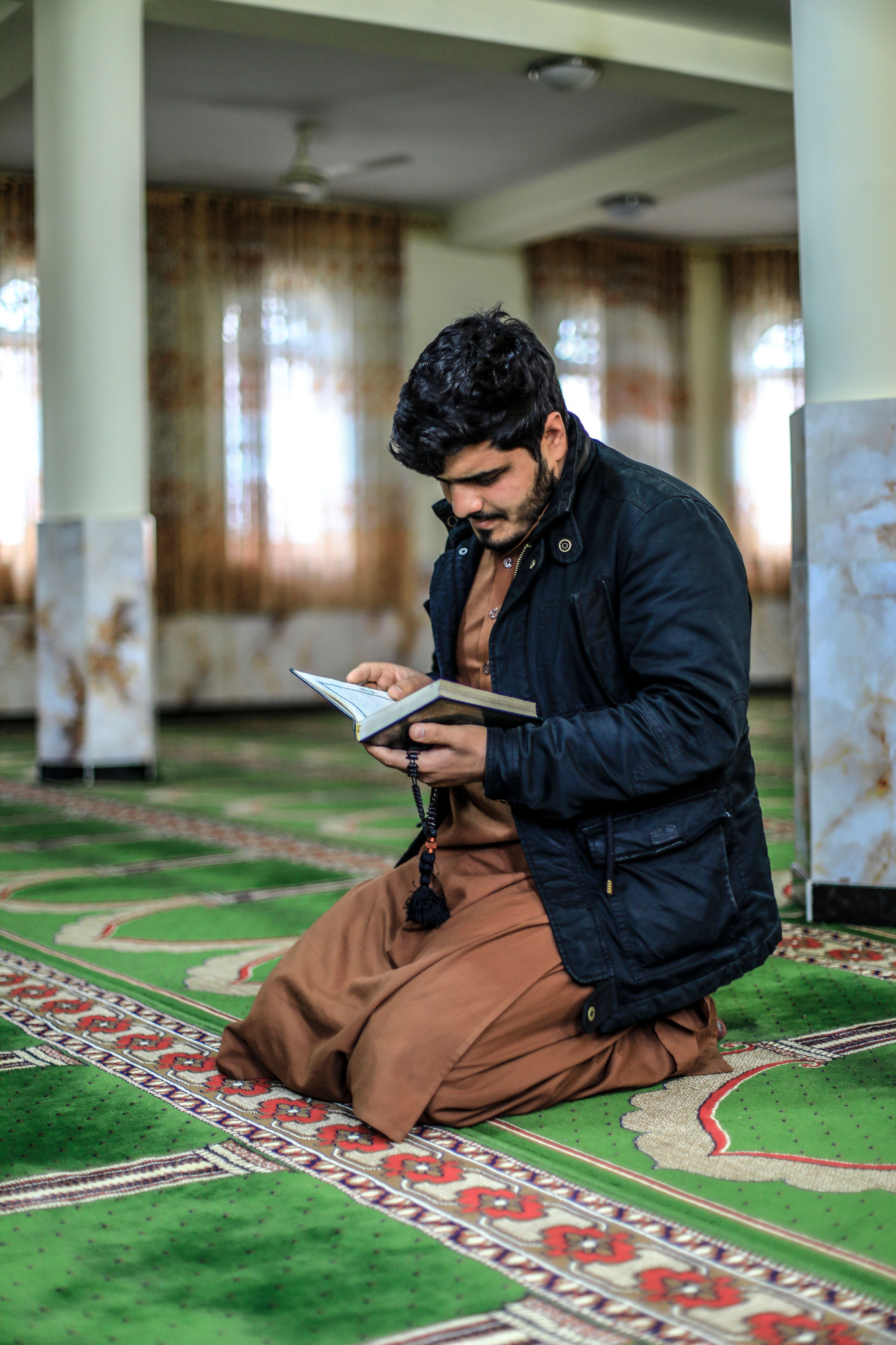 Man Praying in Mosque · Free Stock Photo