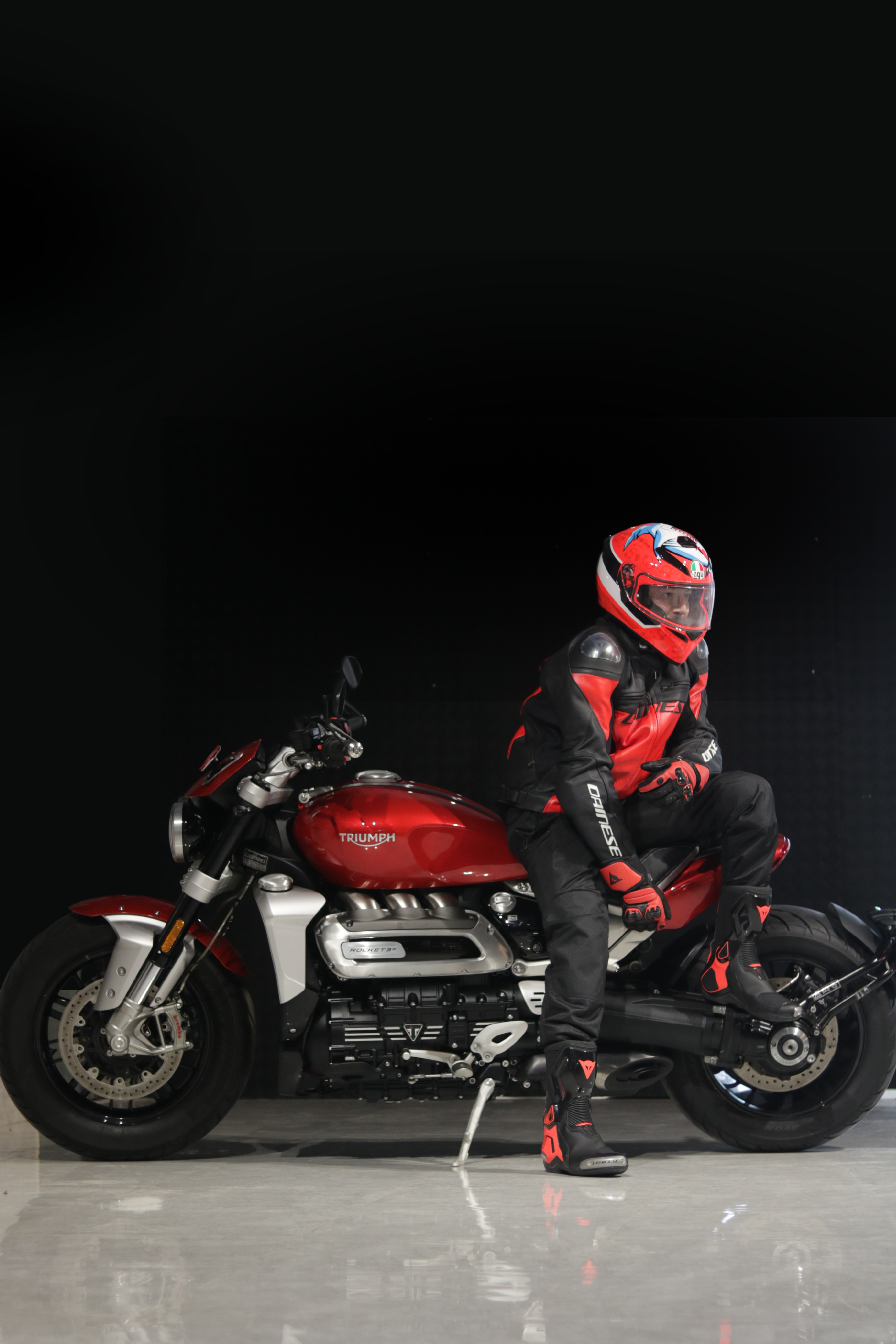 A Motorcycle Sitting on a Triumph Motorcycle · Free Stock Photo