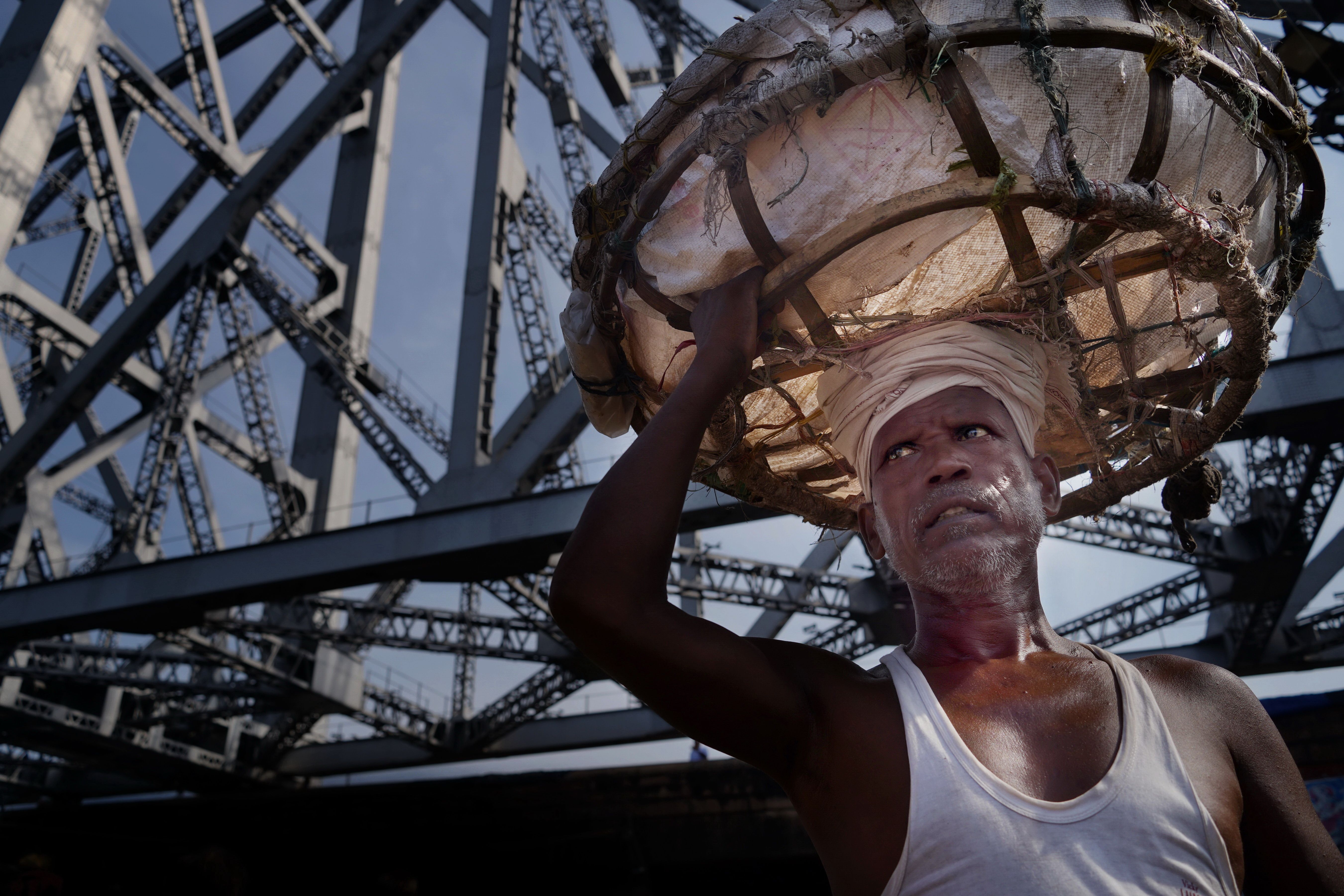 Man Carrying Basket on Head · Free Stock Photo