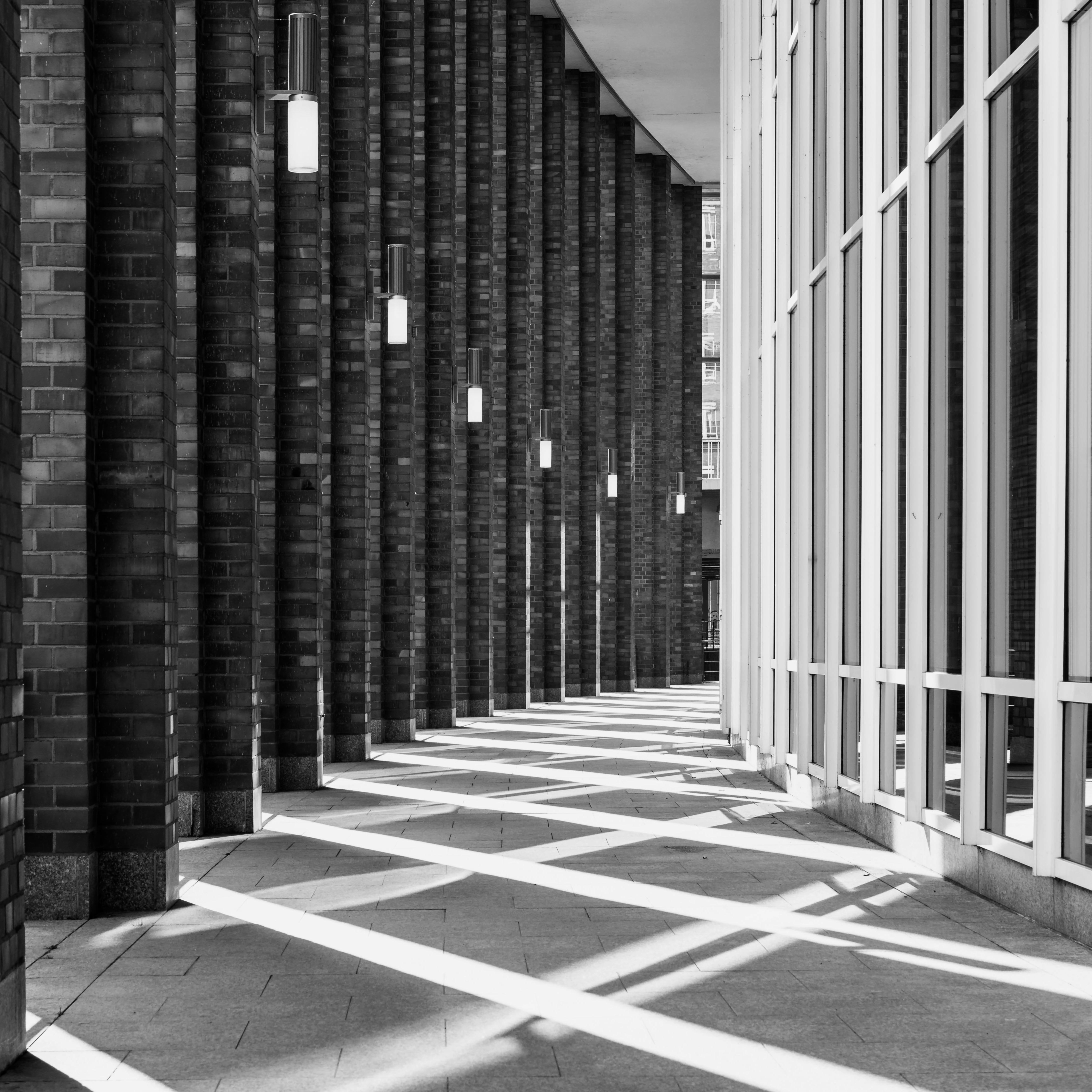Colonnade near Building Windows · Free Stock Photo