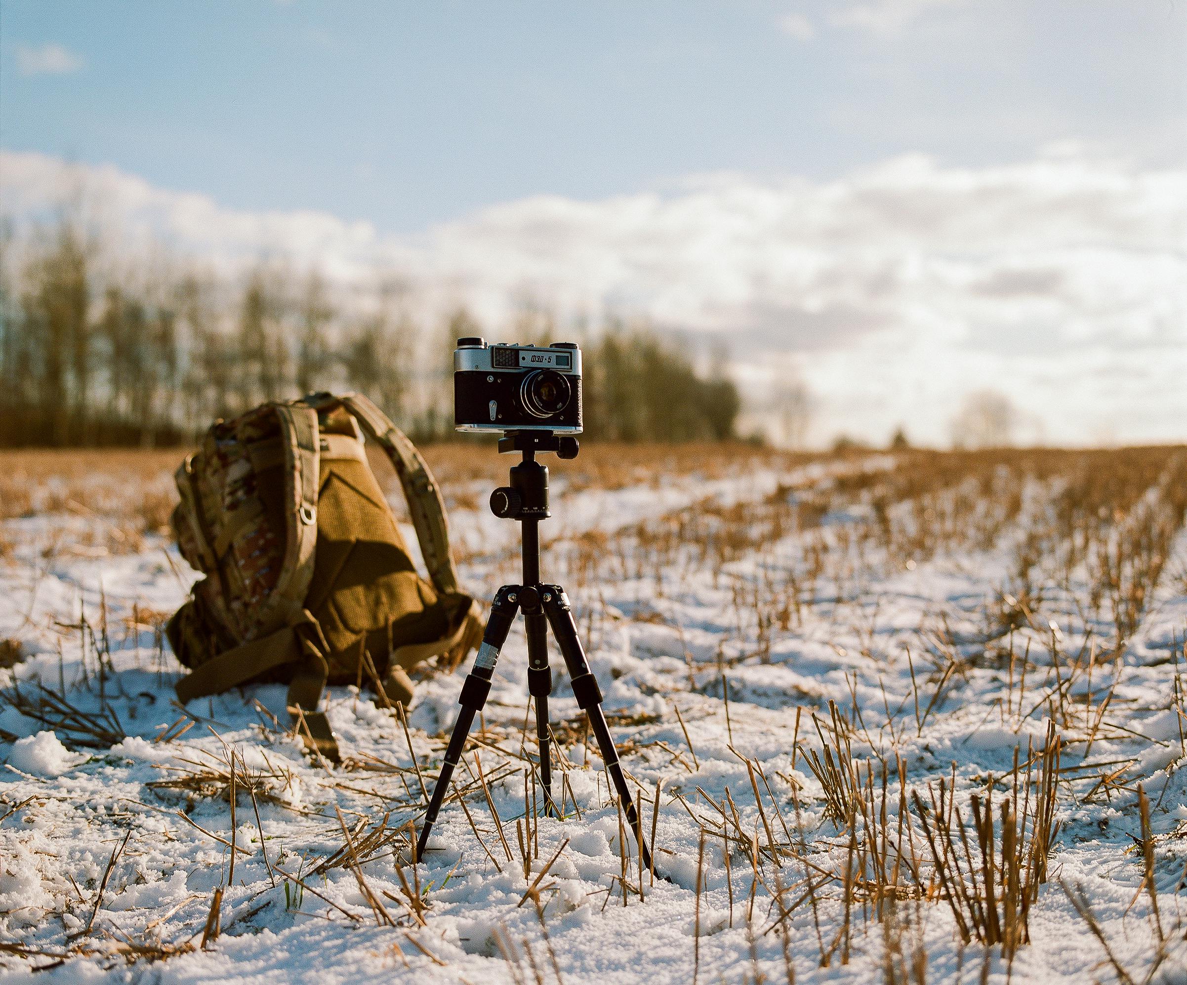 Camera on Tripod on Field in Snow · Free Stock Photo