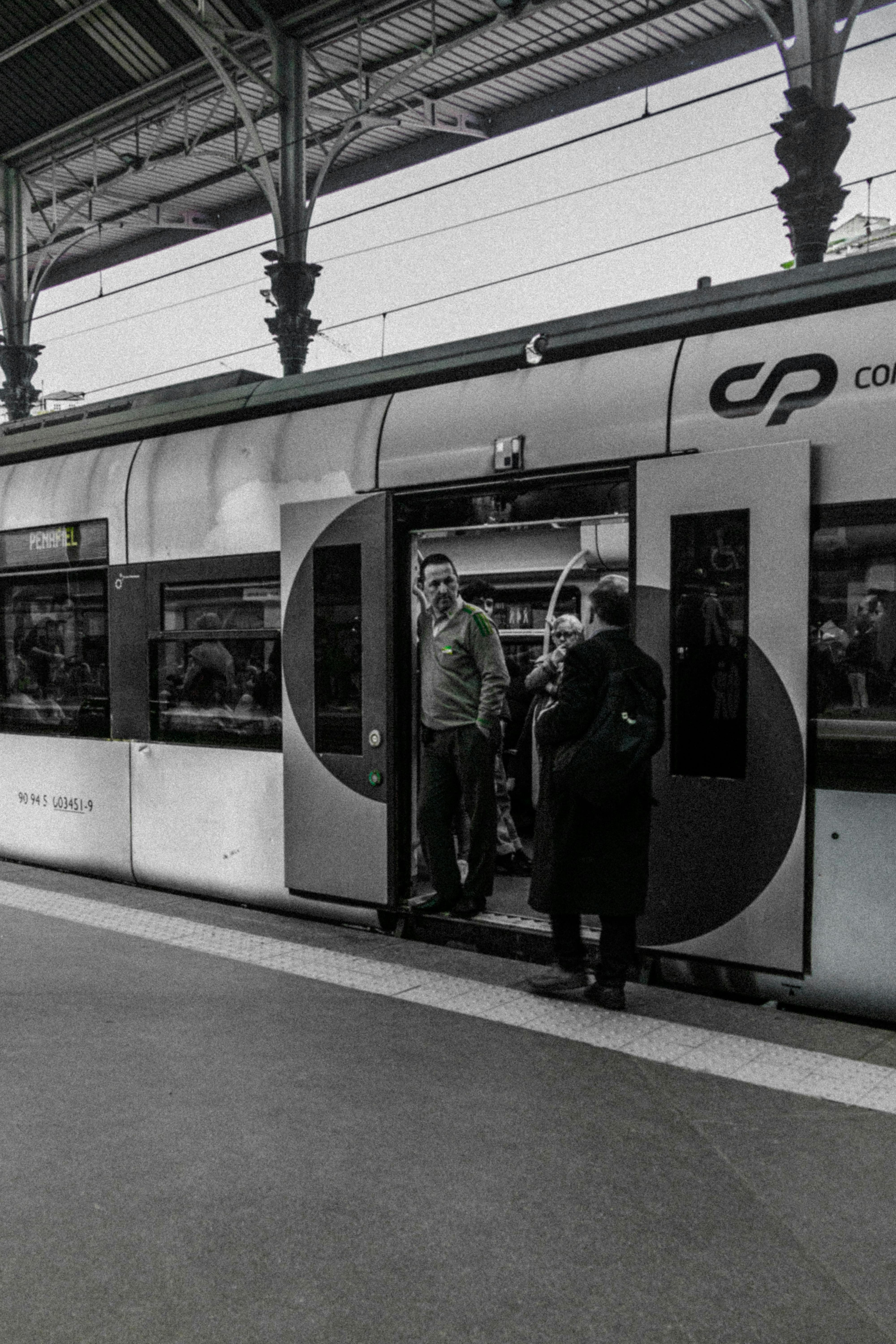 Man Talking to a Conductor in the Doorway of a Train Carriage · Free ...