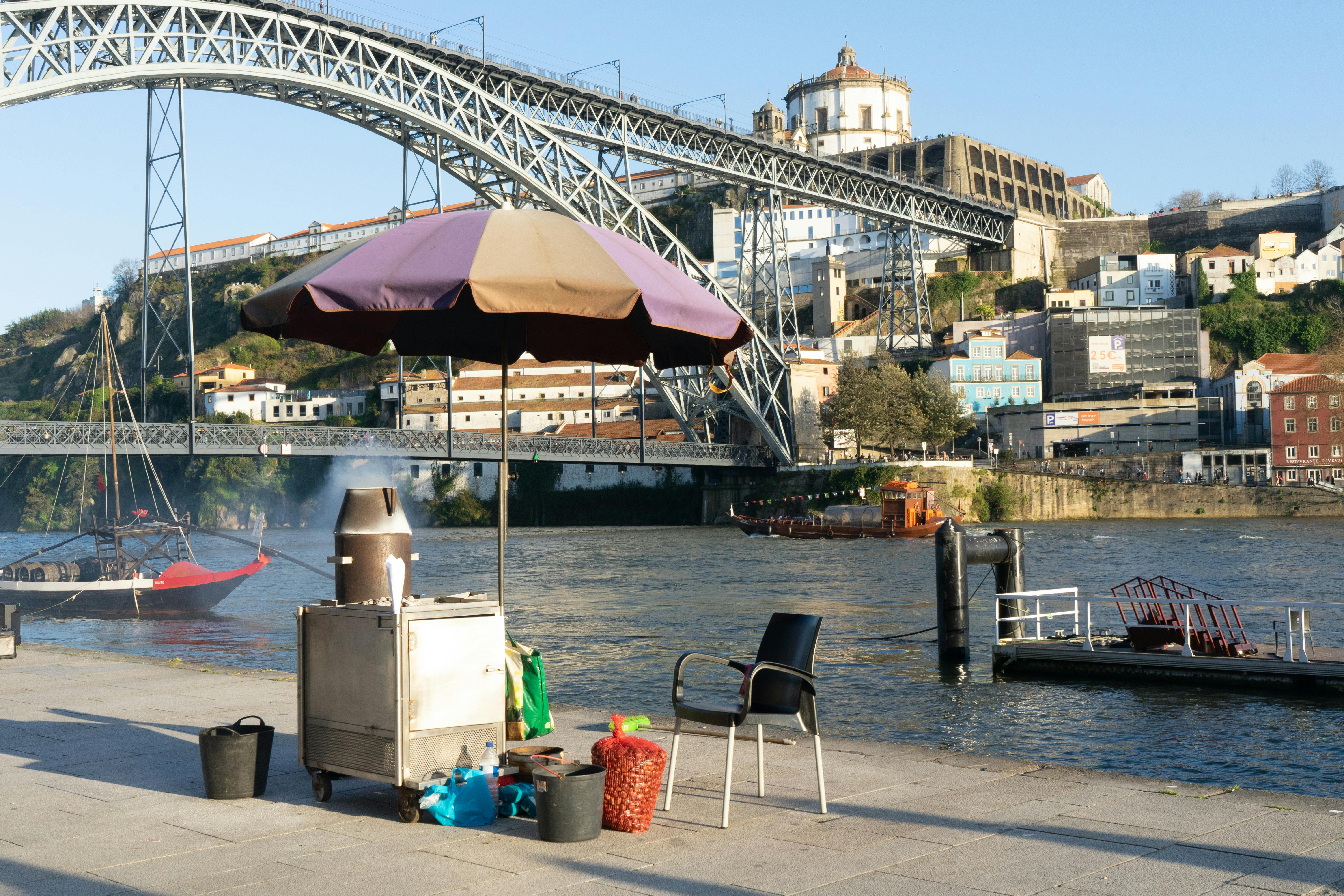 Cart with Roasted Chestnuts on the Riverside Promenade in Porto Portugal · Free Stock Photo