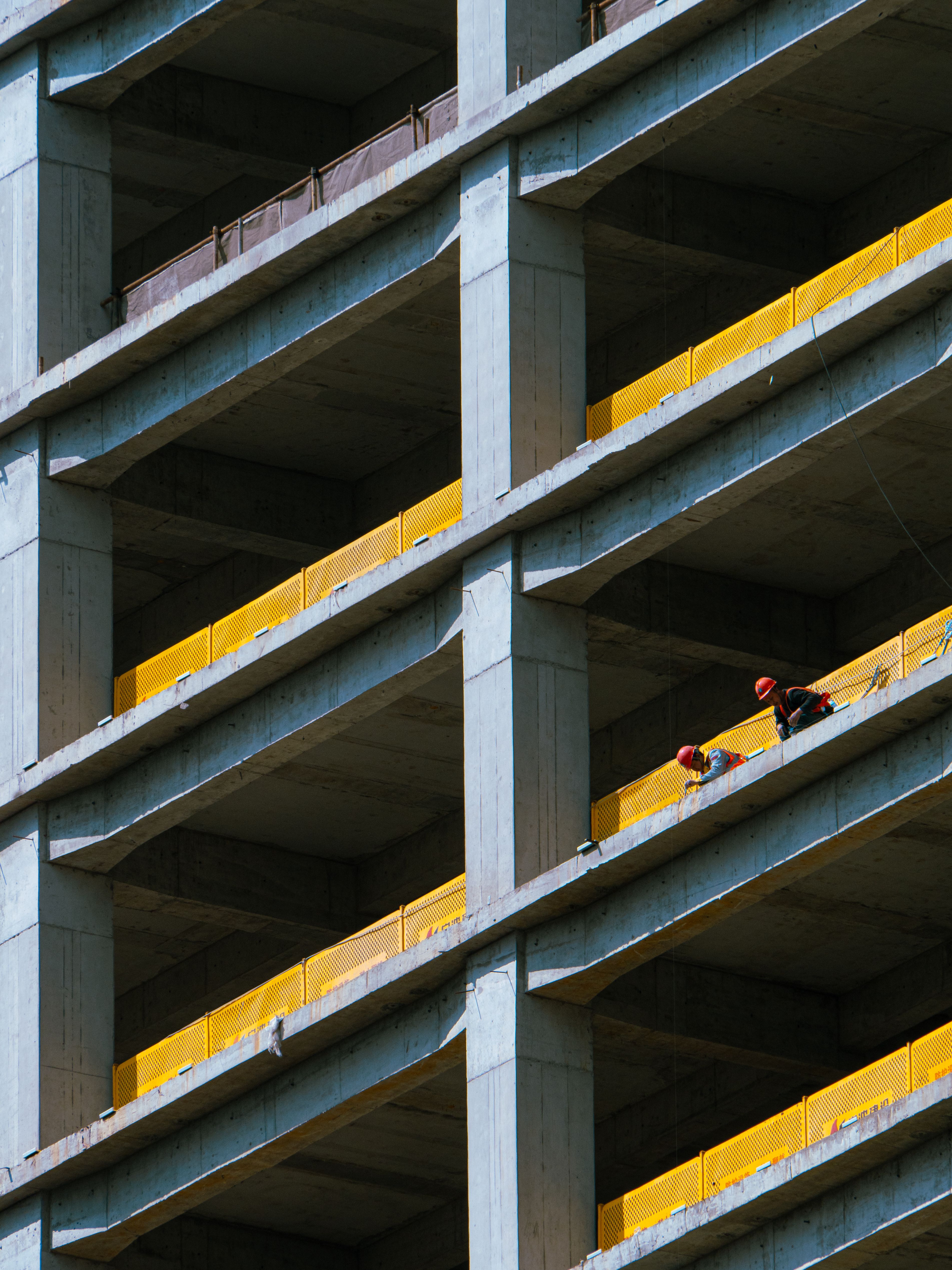 Workers at the Construction Site of a Skyscraper · Free Stock Photo