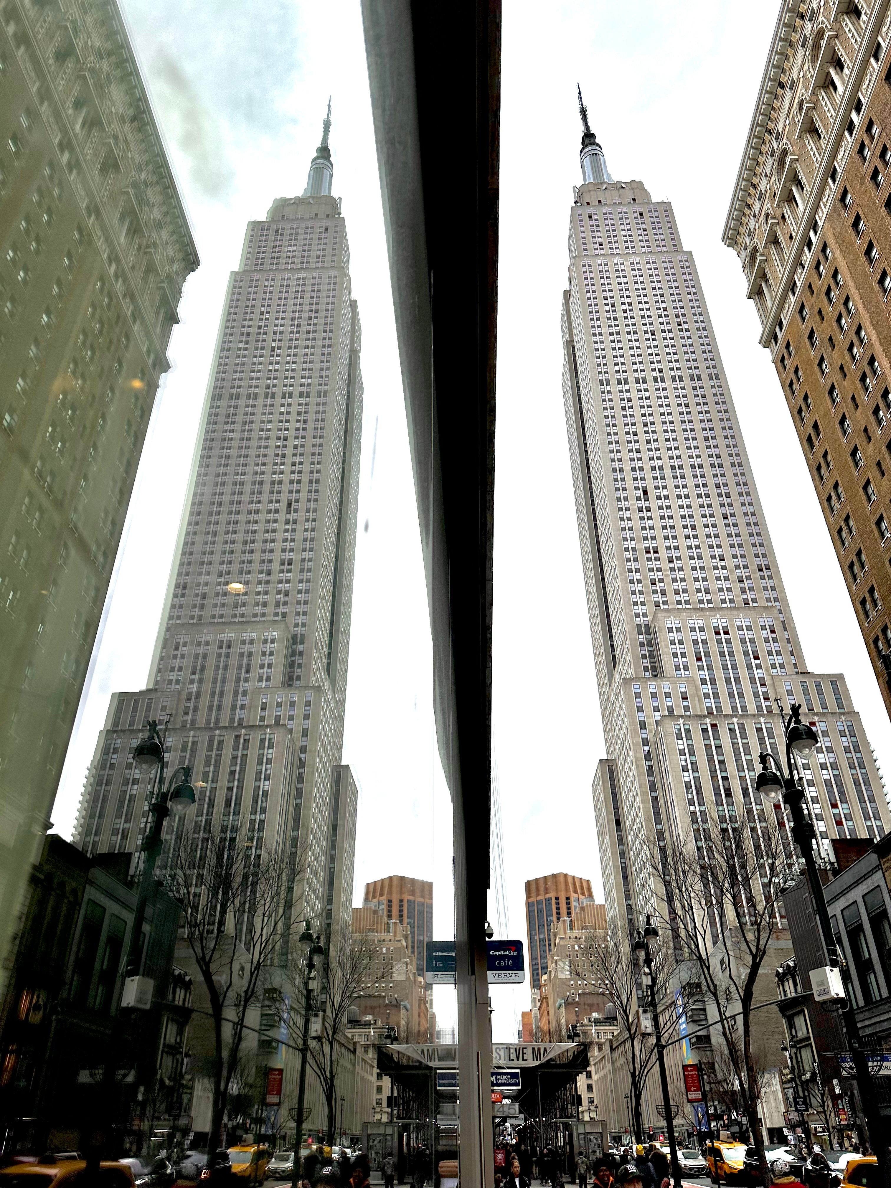 Window Reflection of Empire State Building in Manhattan · Free Stock Photo