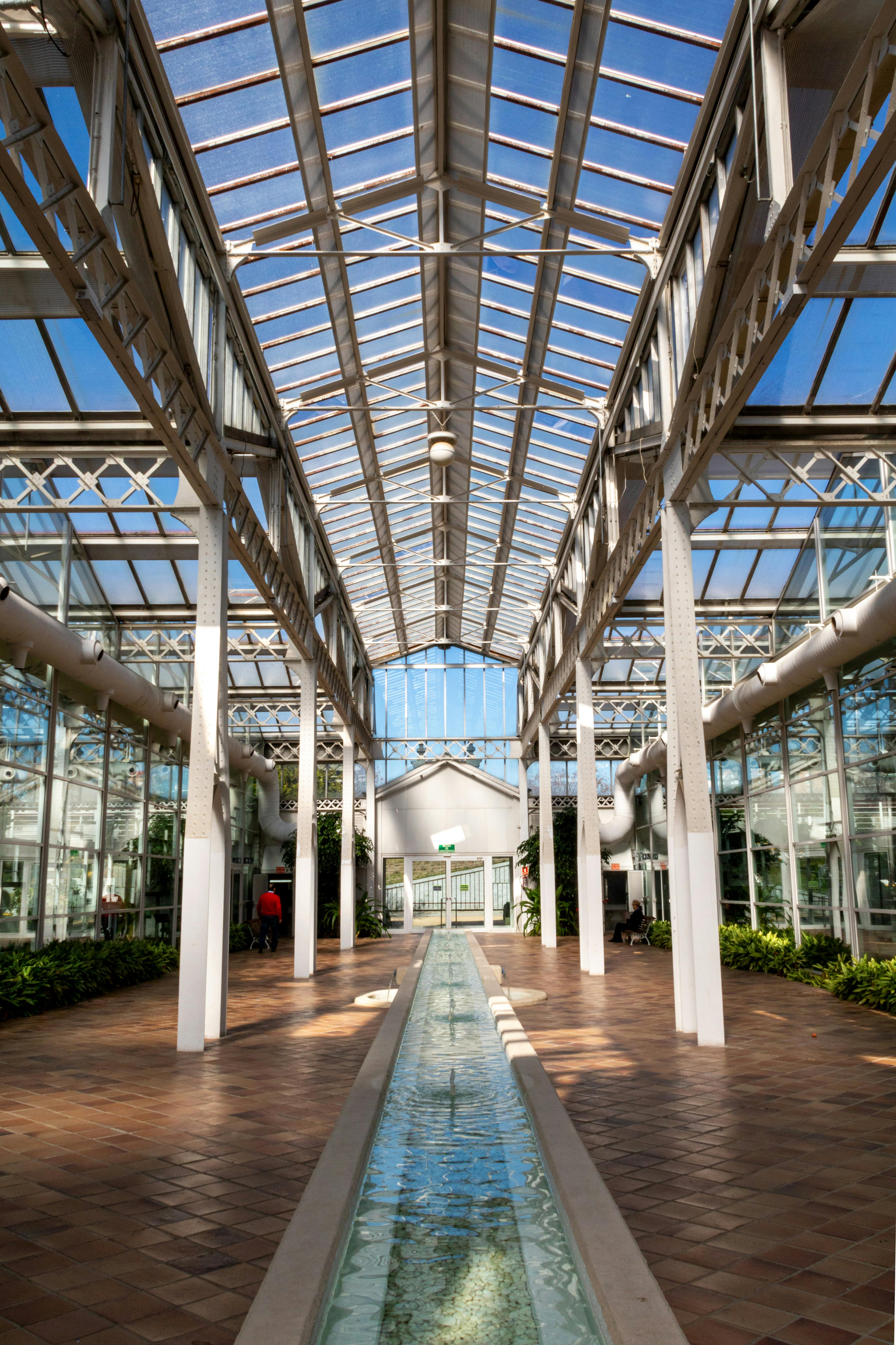 Water Fountain Running through Glass Pavili · Free Stock Photo