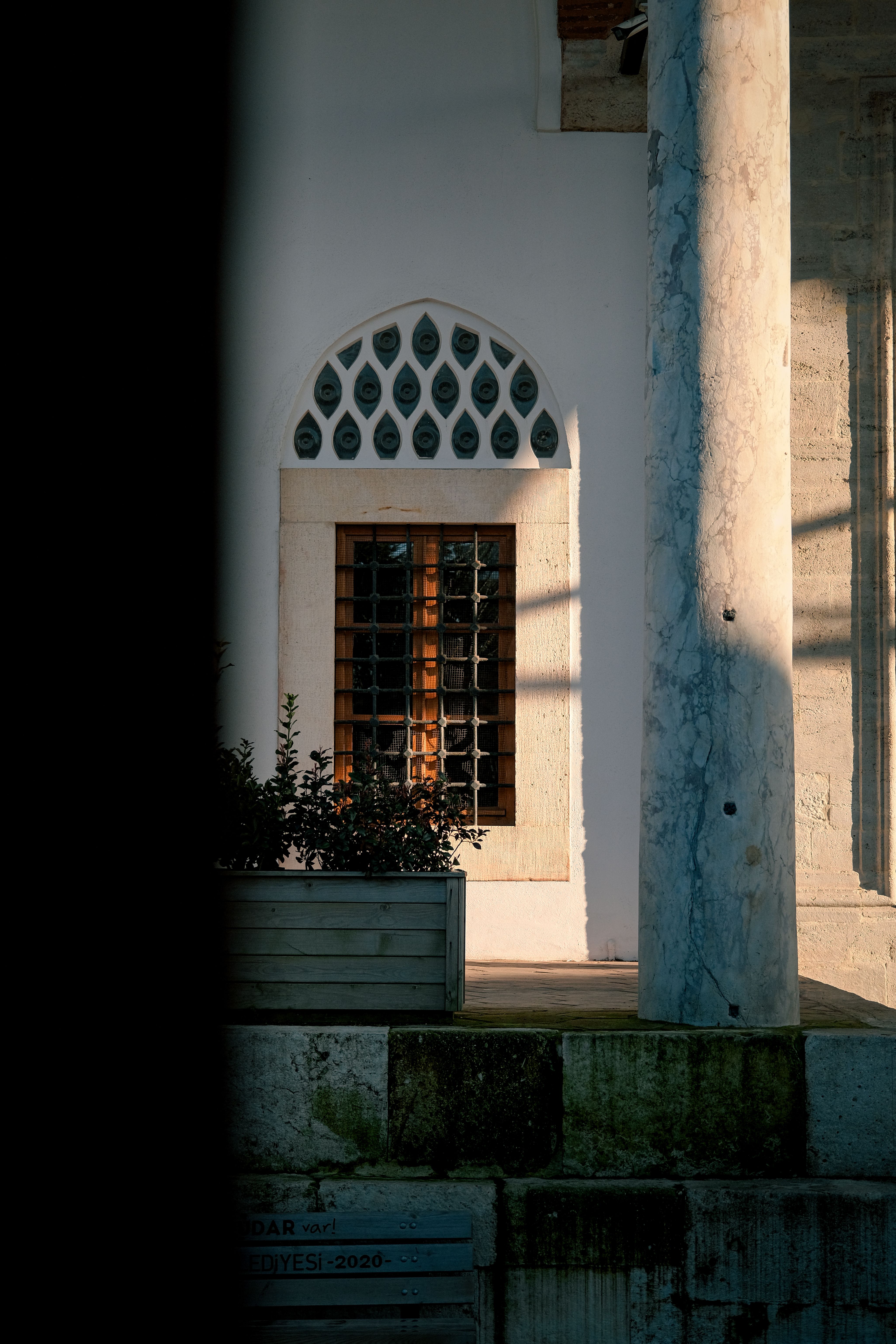 White Facade of a Building with an Ottoman Styled Window · Free Stock Photo