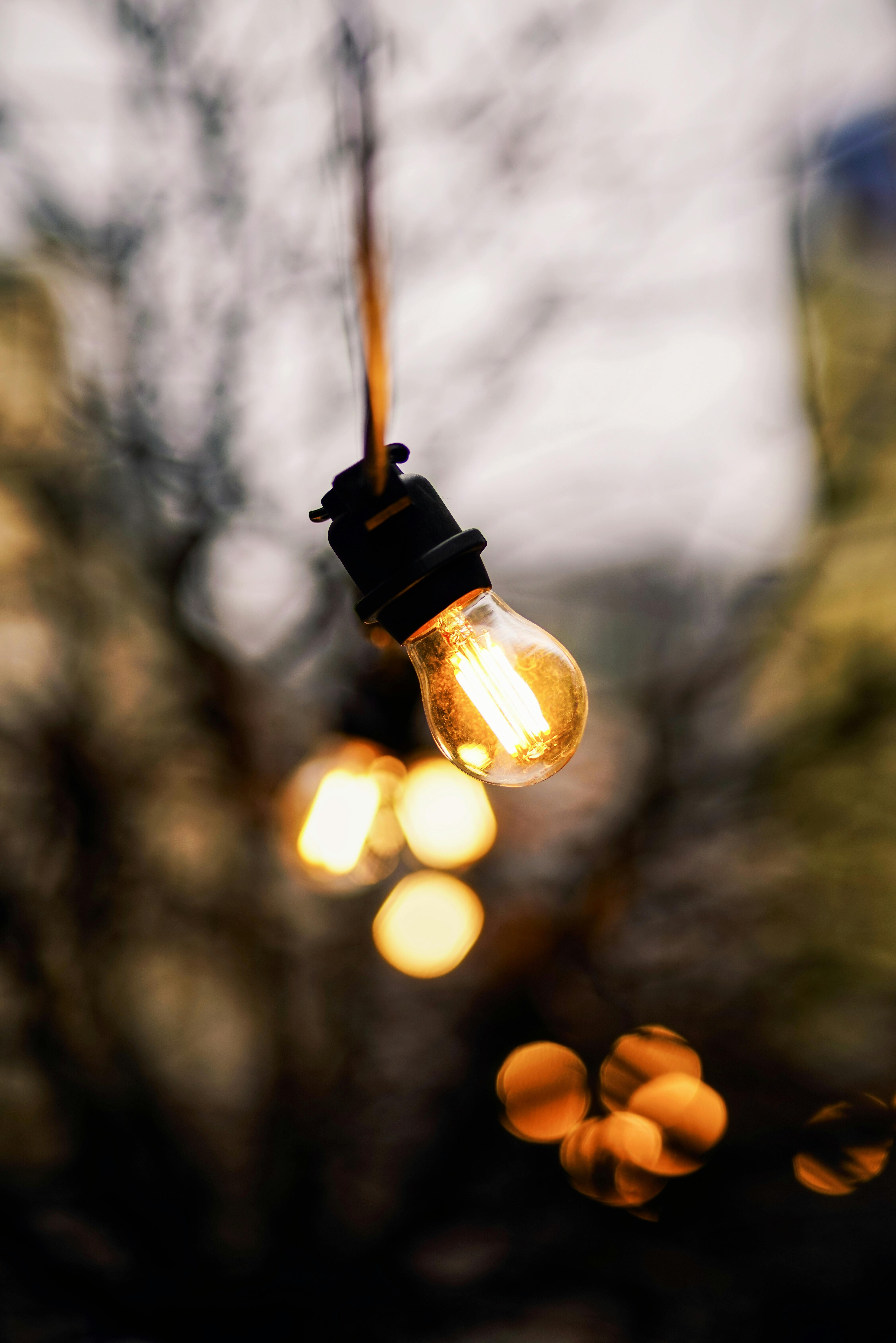 Close-Up Photo of Three Hanging Light Bulbs · Free Stock Photo